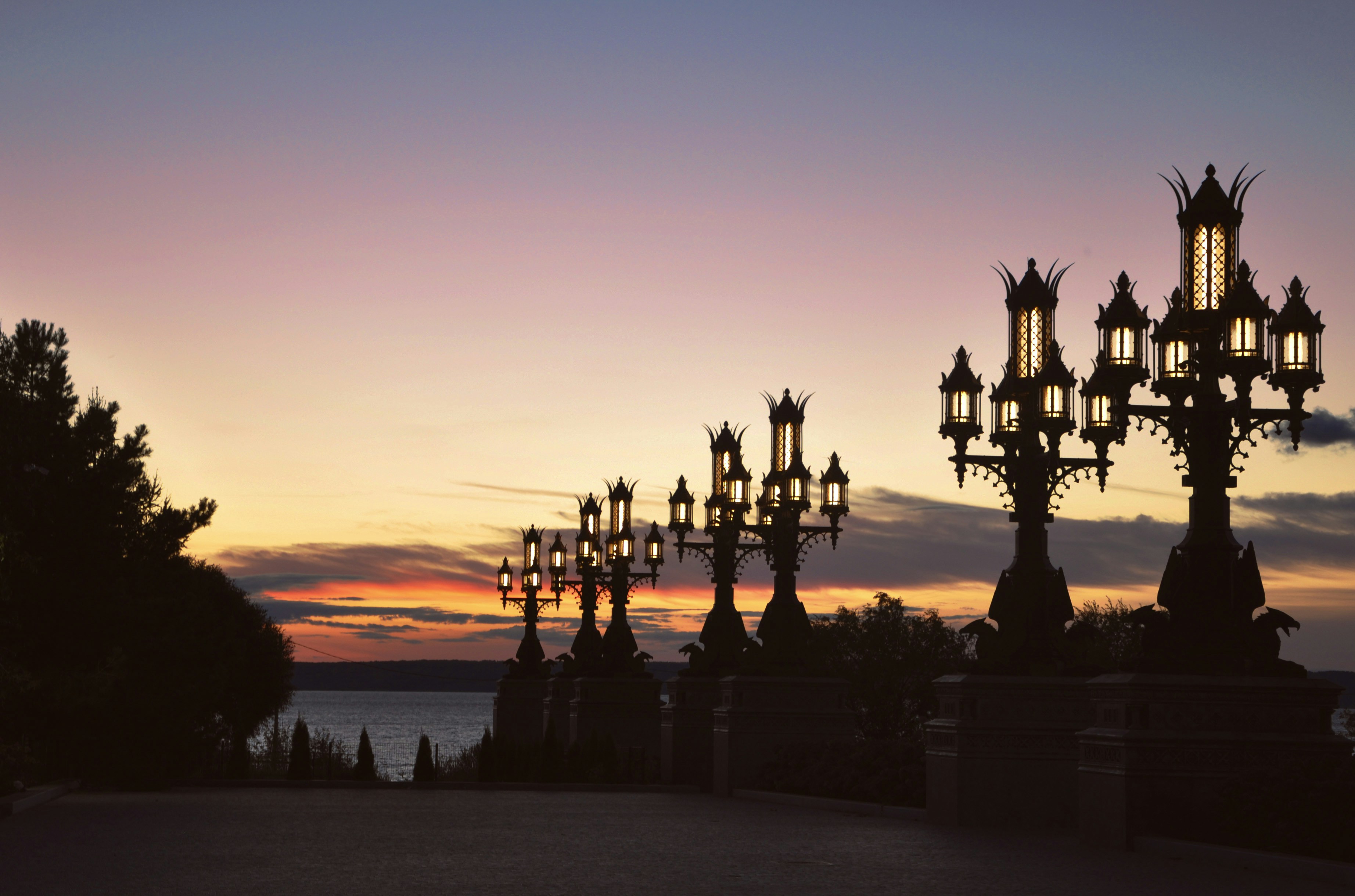 Lantern Row at Sunset: Silhouettes on the Waterfront Promenade