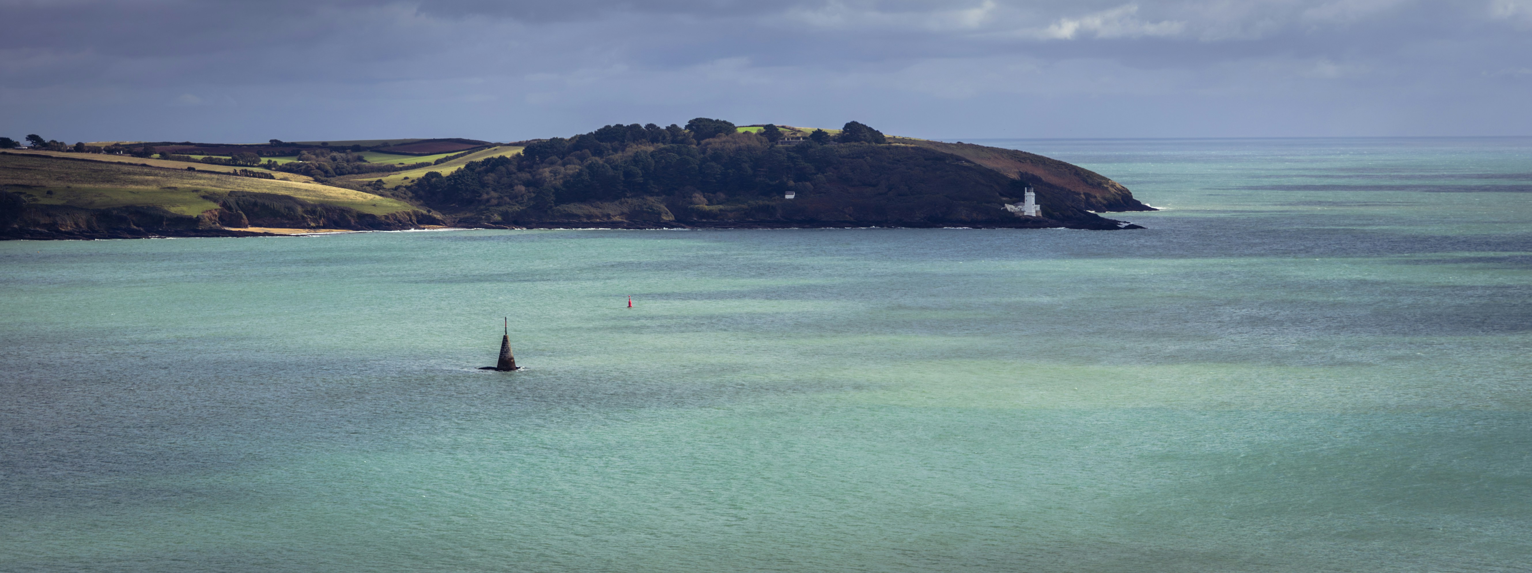 Coastal Calm: Turquoise Waters Meet a Distant Headland