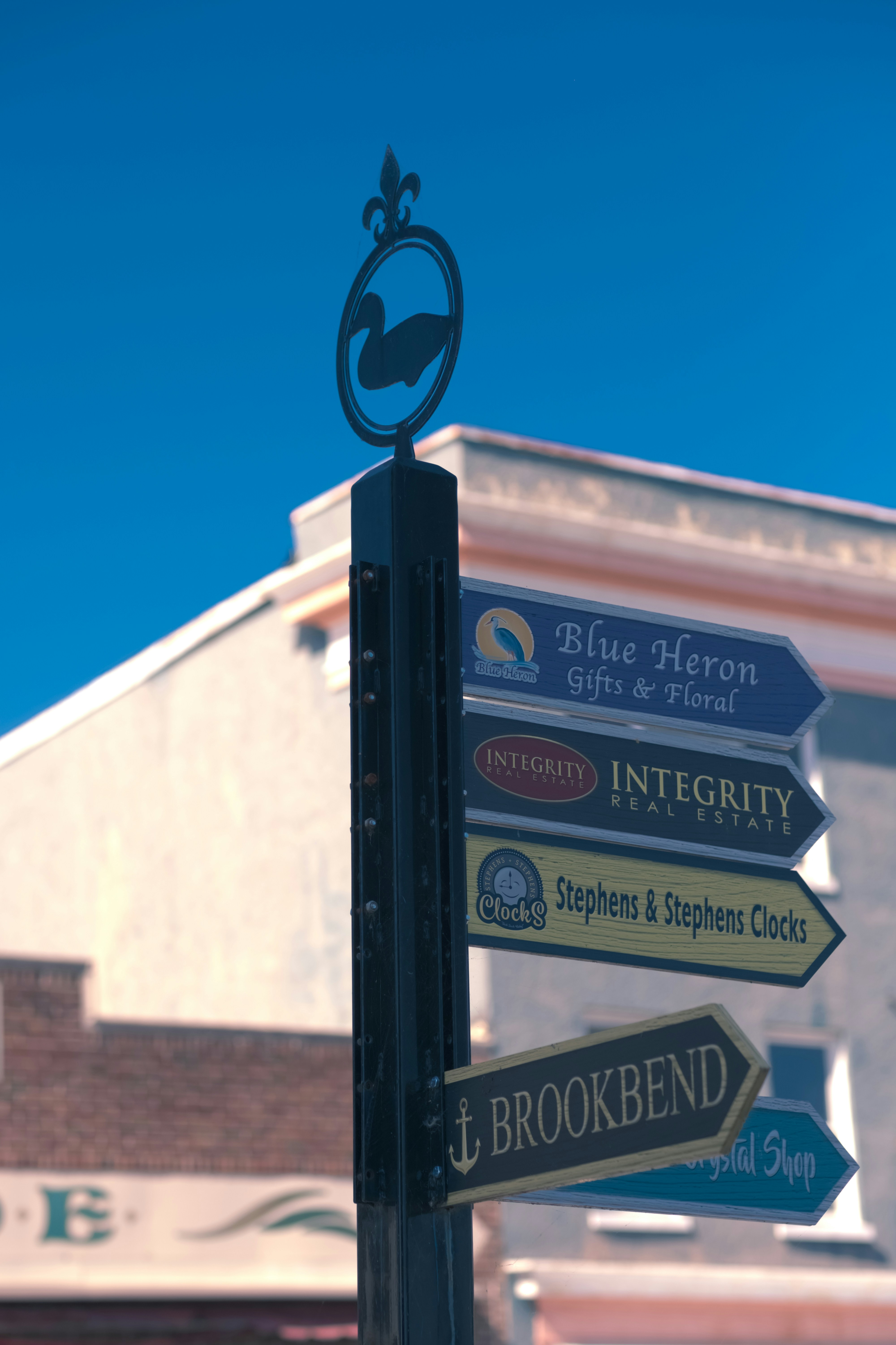 A pole with a bunch of street signs on it