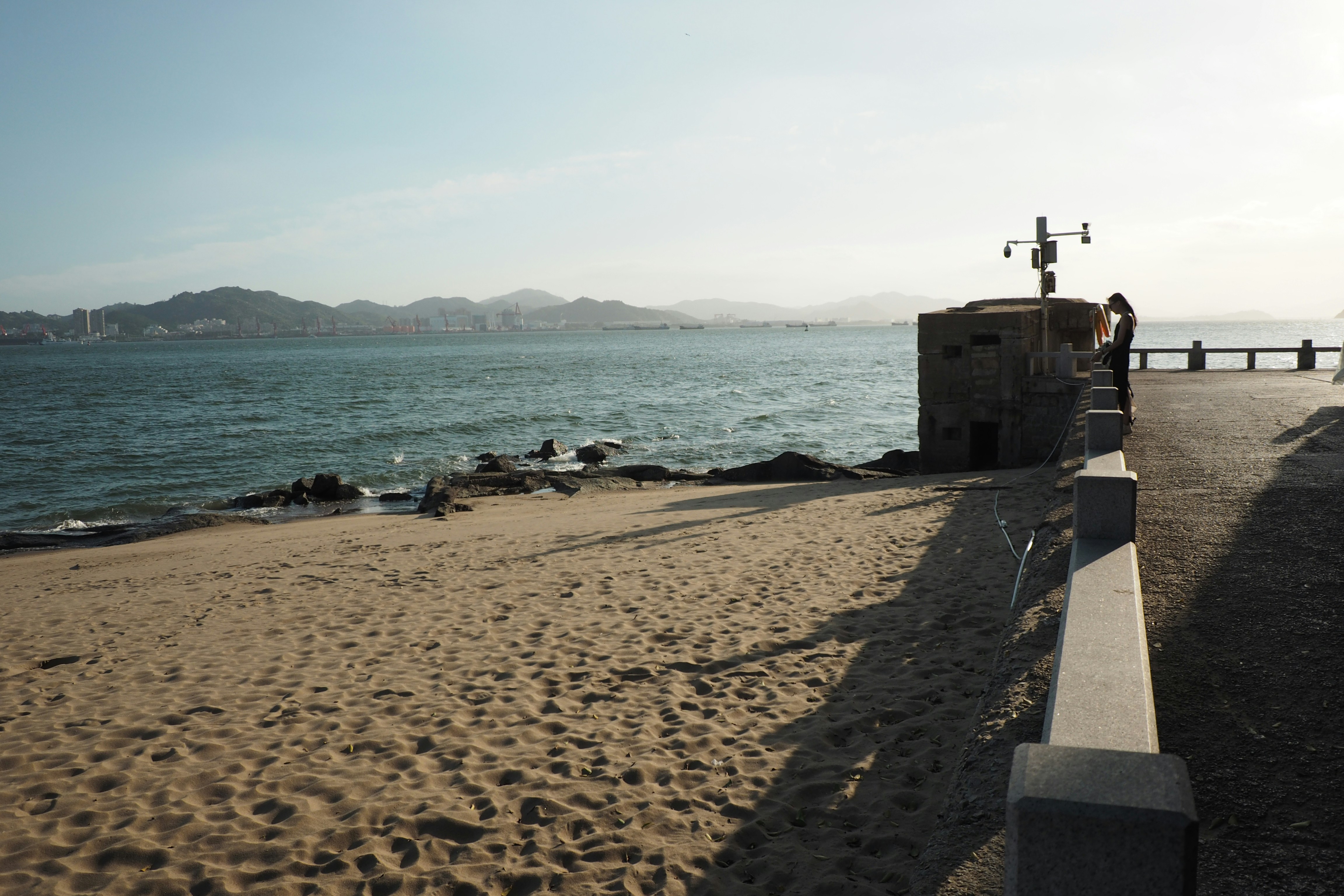 Line of Shadows: The Pier Reaches Toward a Quiet Sea