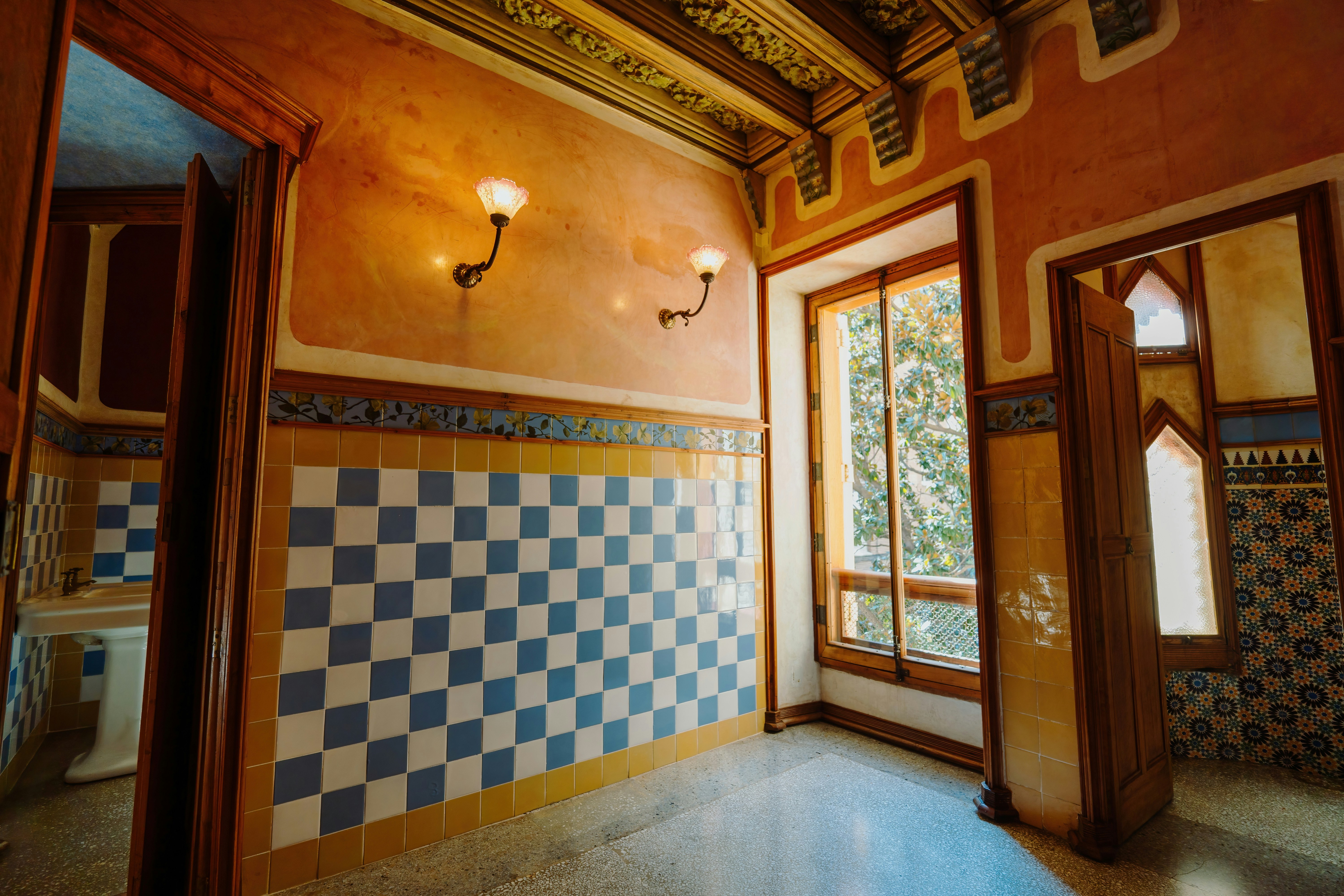 Sunlit Tile Hallway with Stained Walls