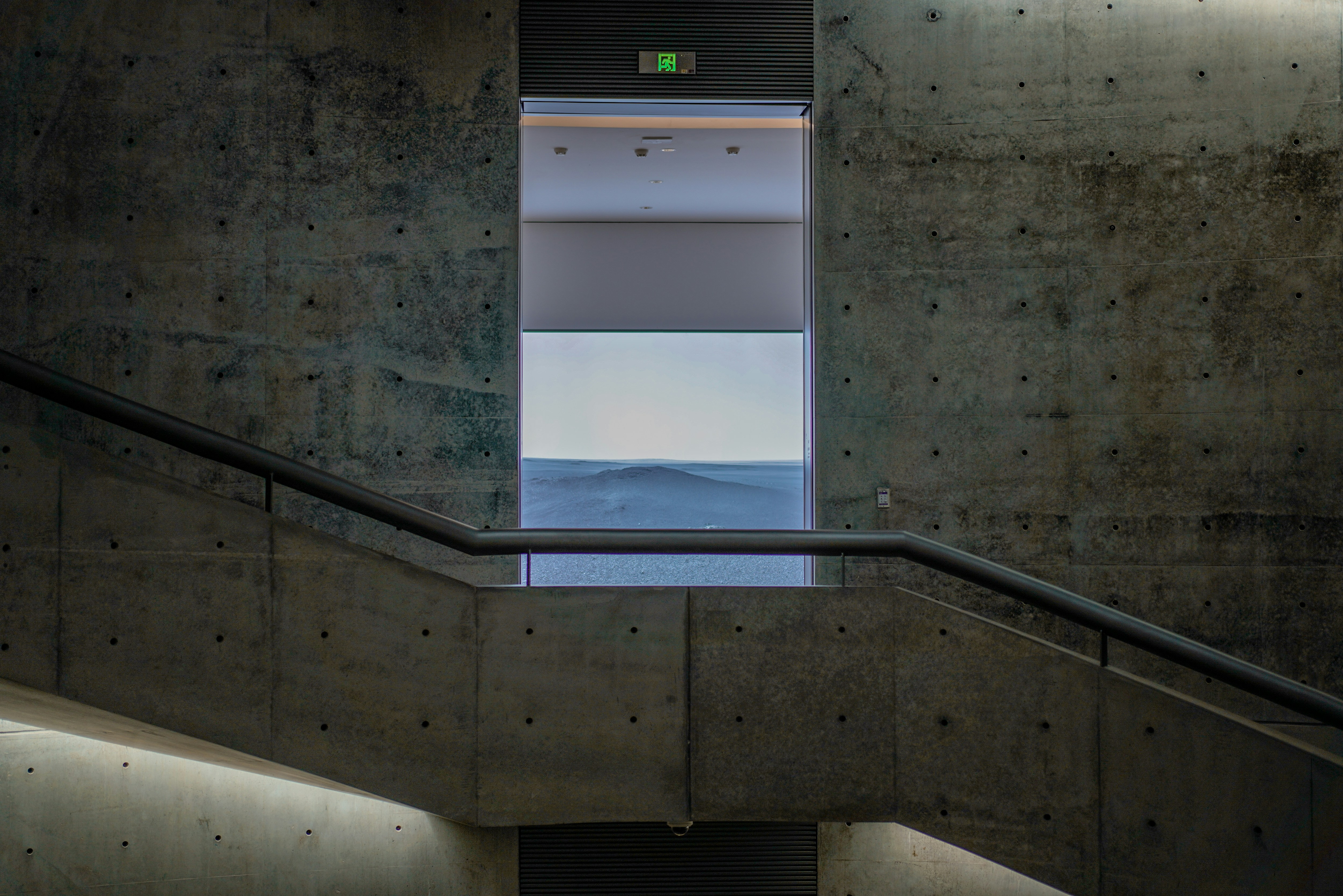 An escalator in a building with a view of the ocean photo – Free China ...