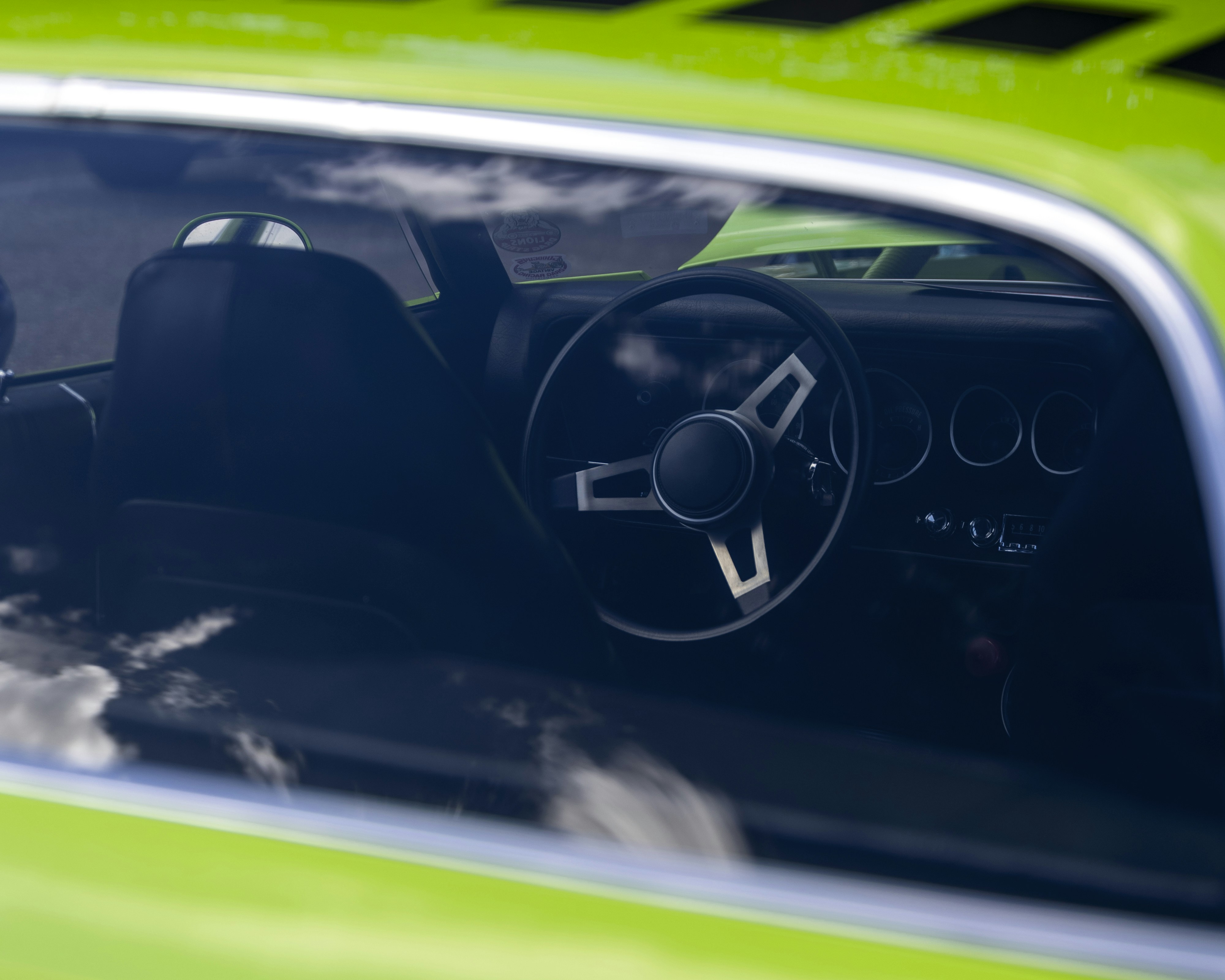 Lime-Coded Cockpit: A Quiet Glimpse of the Steering Wheel and Gauges