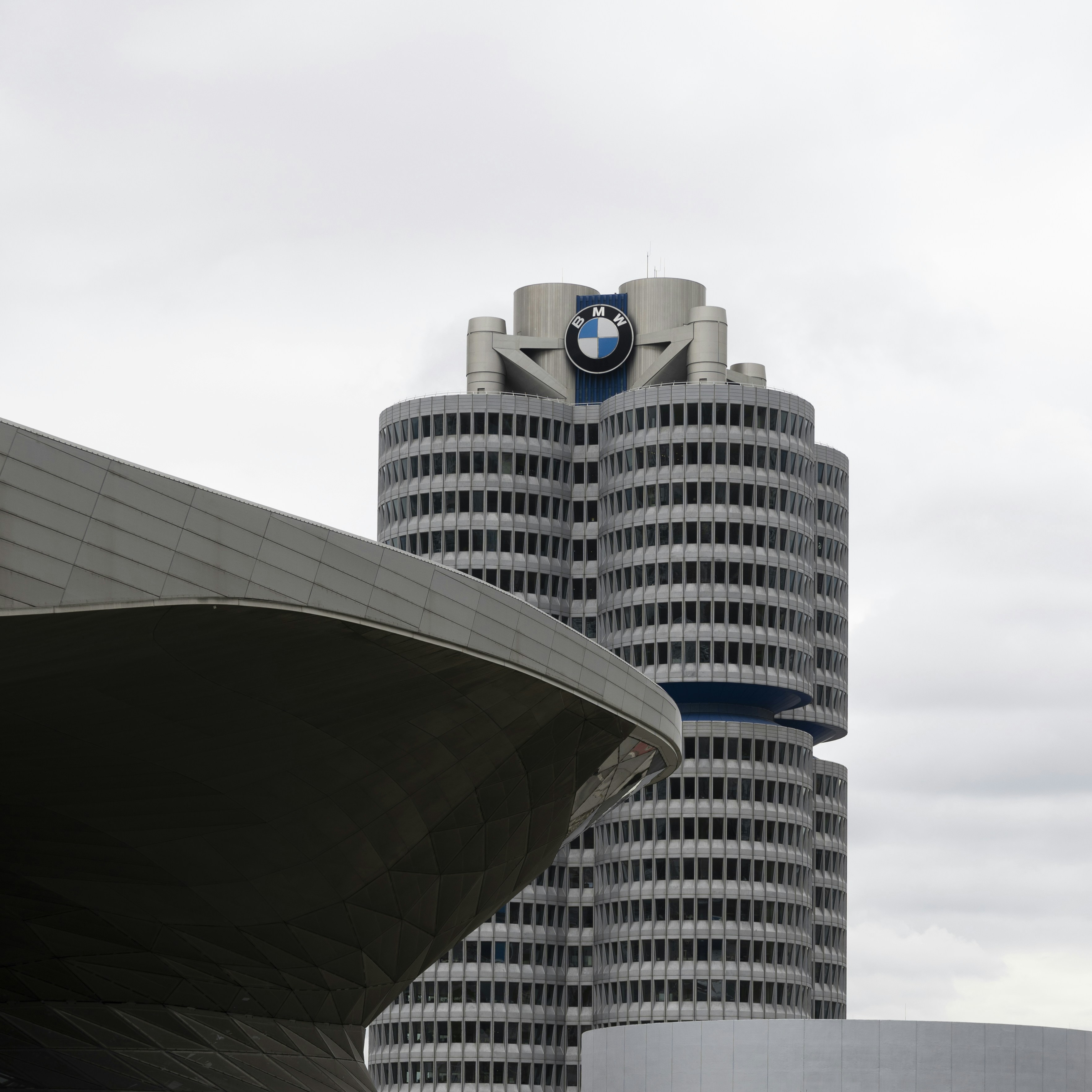 BMW Tower Crowned by a Curved Canopy