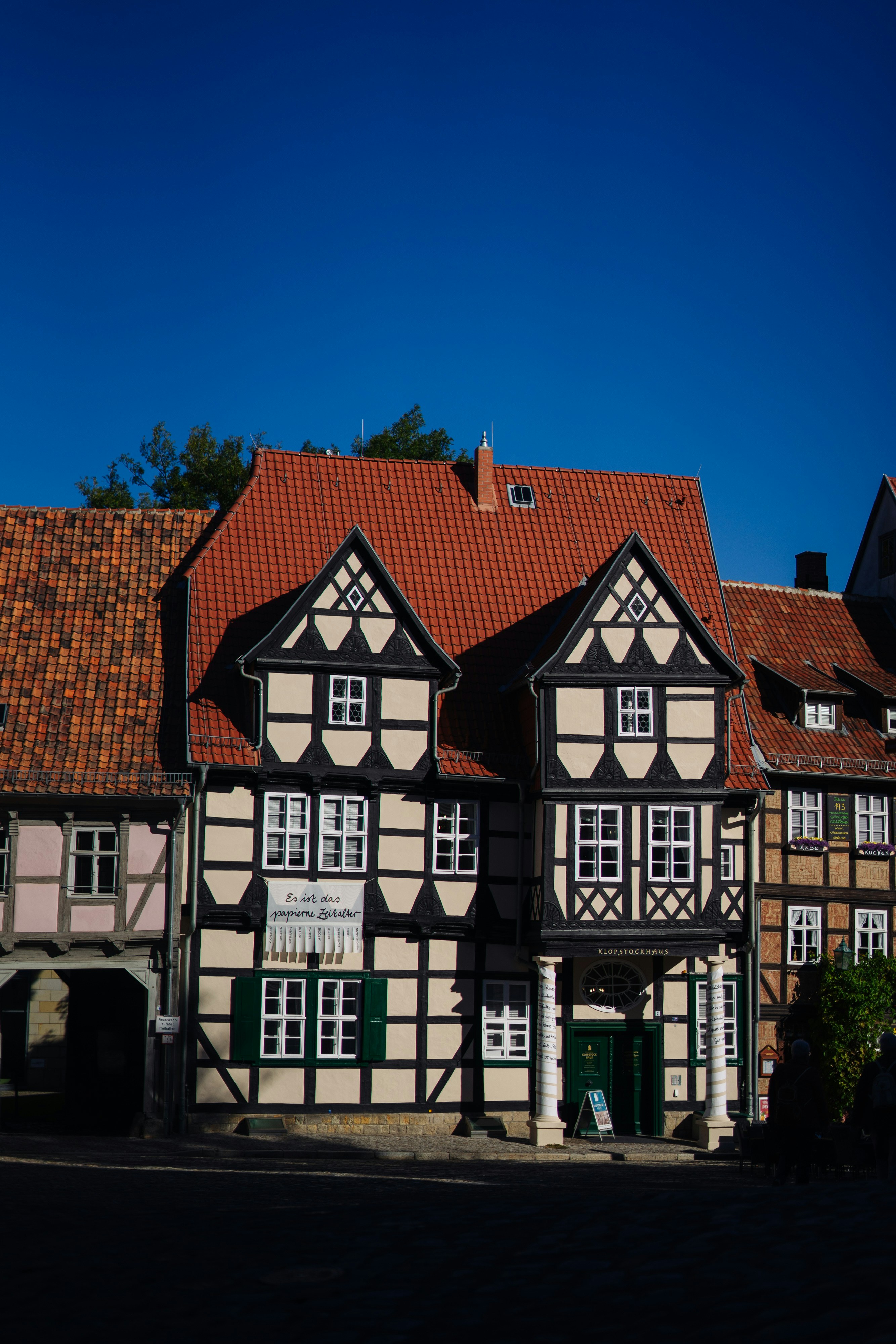 A row of buildings with a red roof photo – Free Timber frame Image on ...