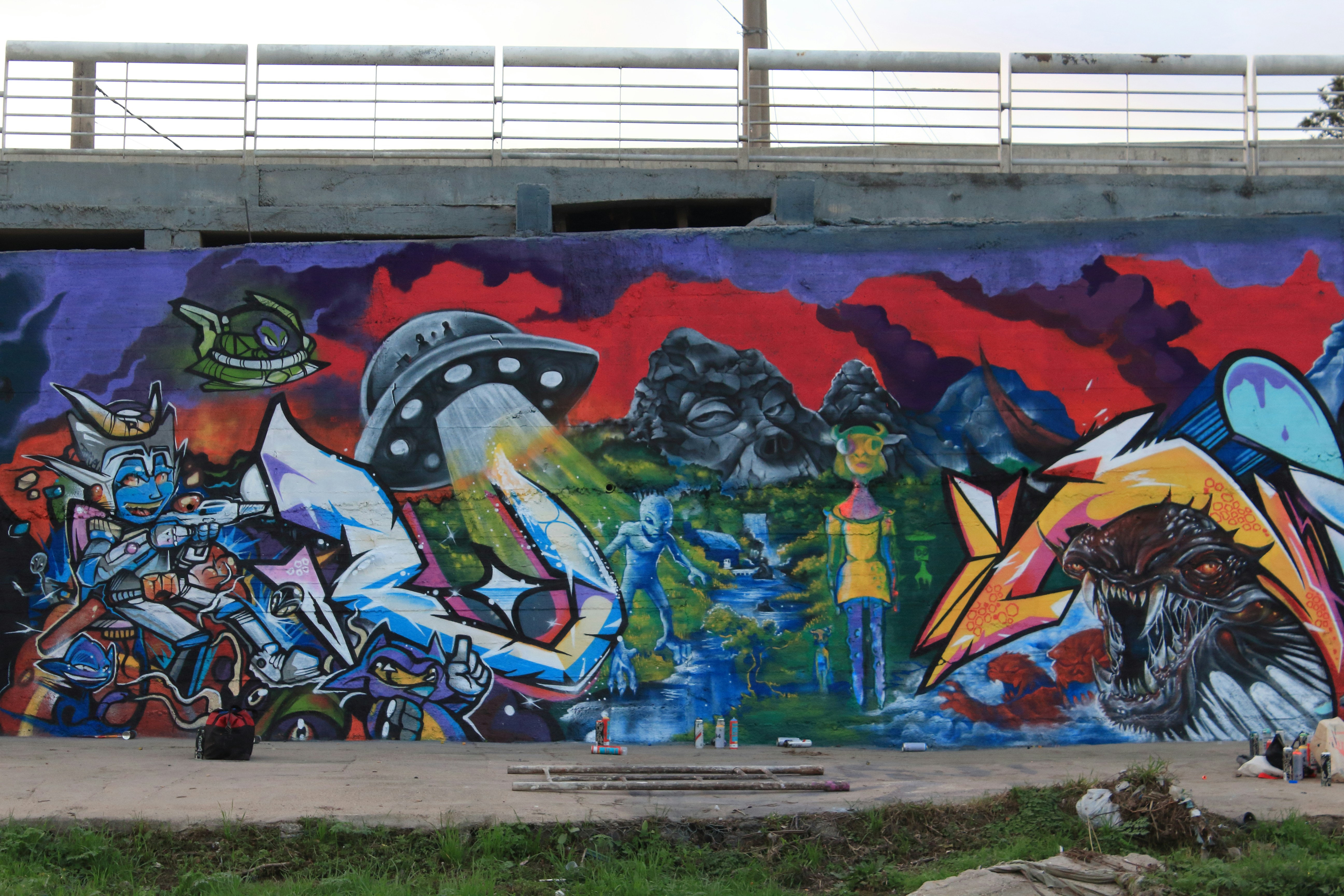 A wall with a bunch of graffiti on it photo – Free Street Image on Unsplash