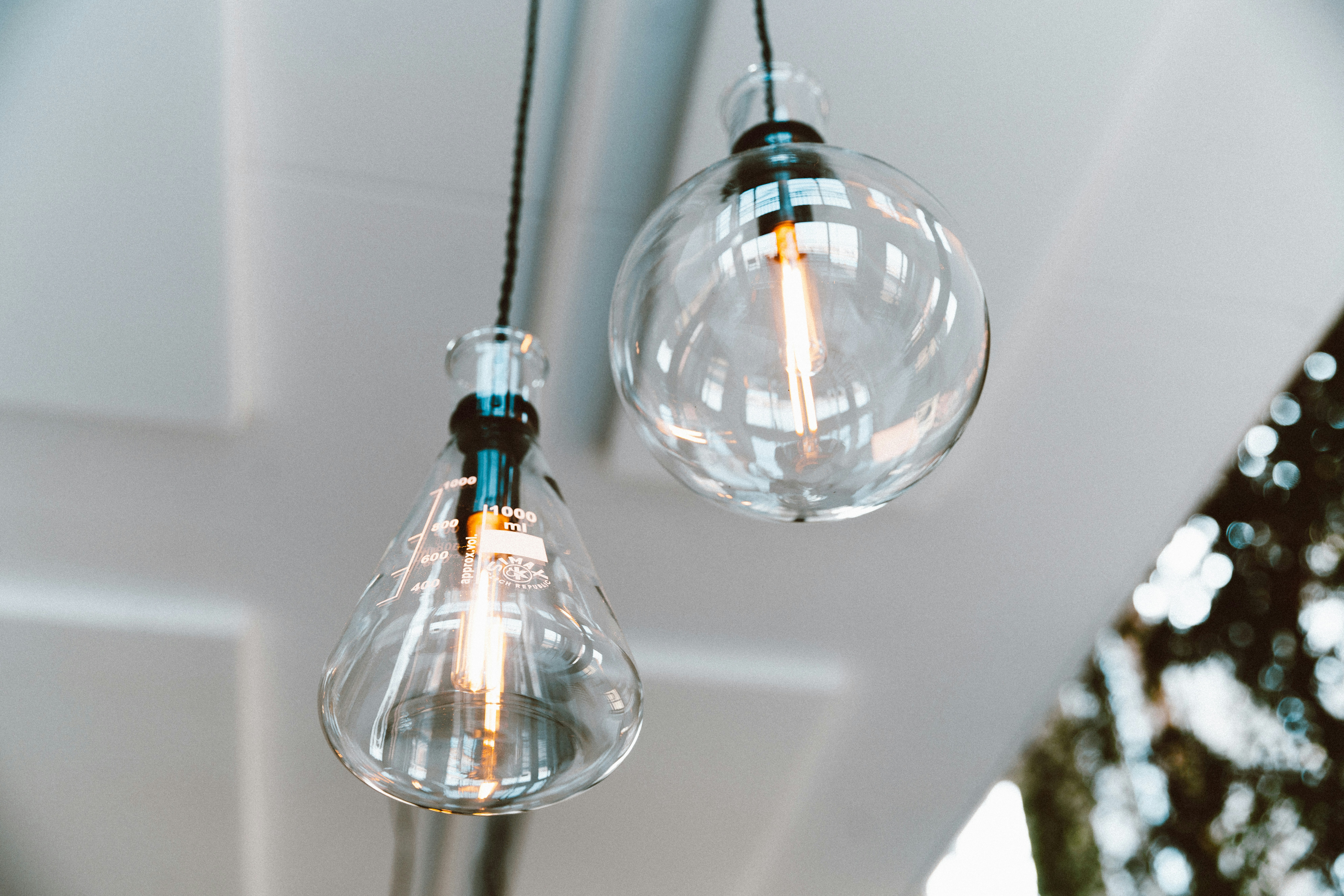 A couple of light bulbs hanging from a ceiling photo – Free Image on ...