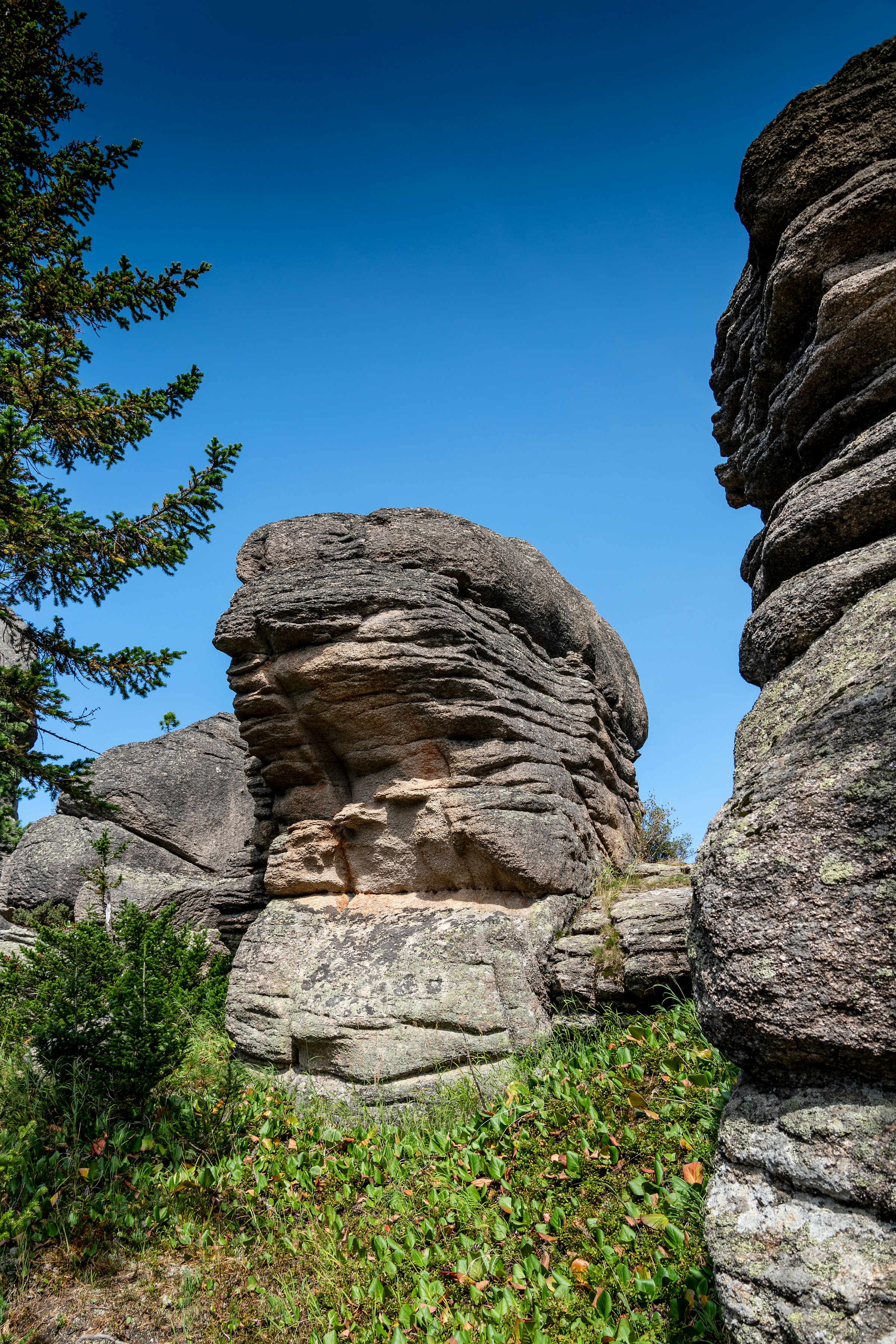 A rock formation with a face carved into it photo – Free Image on Unsplash