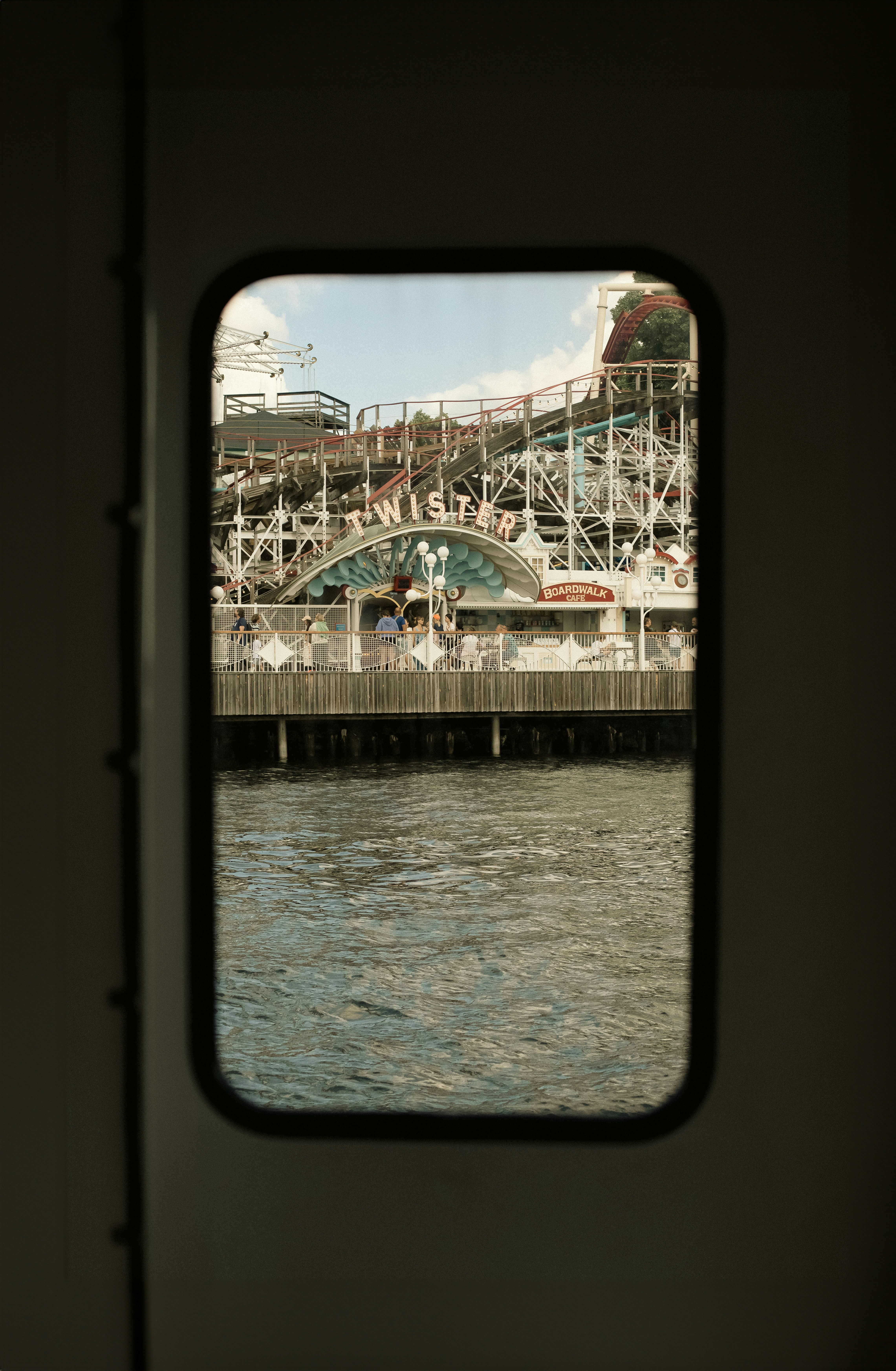 A view of a roller coaster through a window photo – Free Retro vibe ...