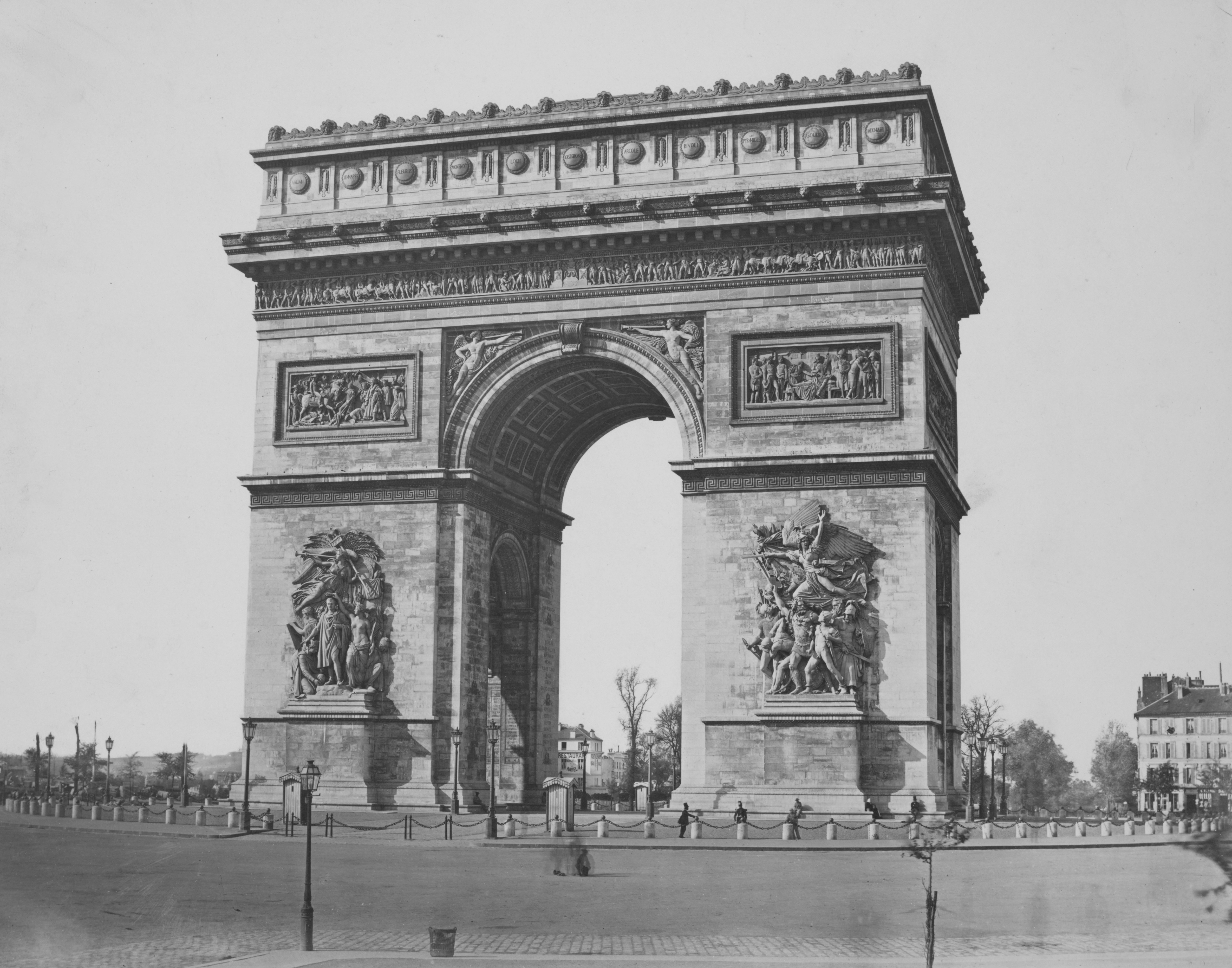 Majestic arch adorned with intricate sculptures, standing proudly in a historic square. The architectural marvel symbolizes national pride and heritage.