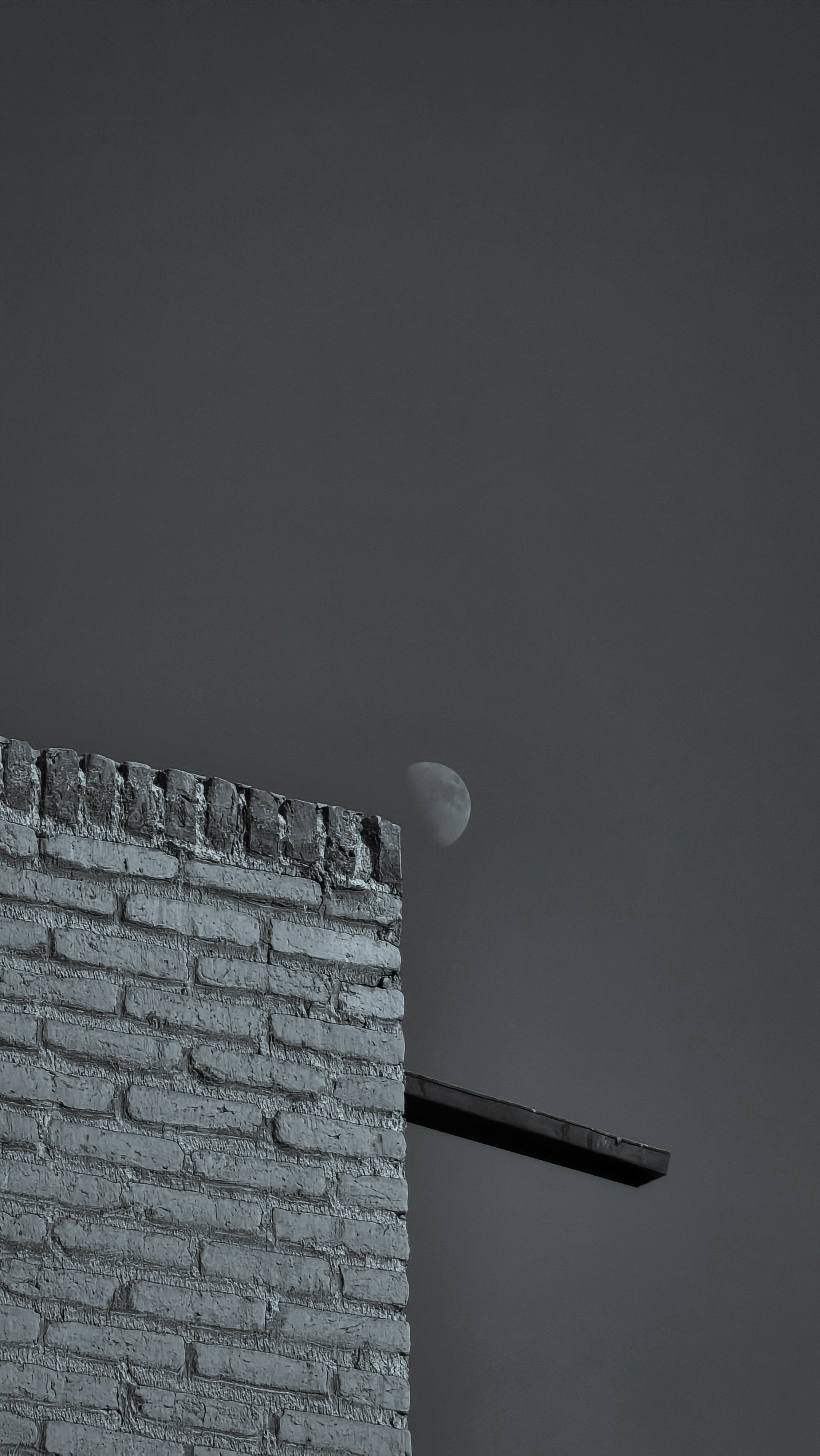 Moonlit Edge Over Quiet Brickwork