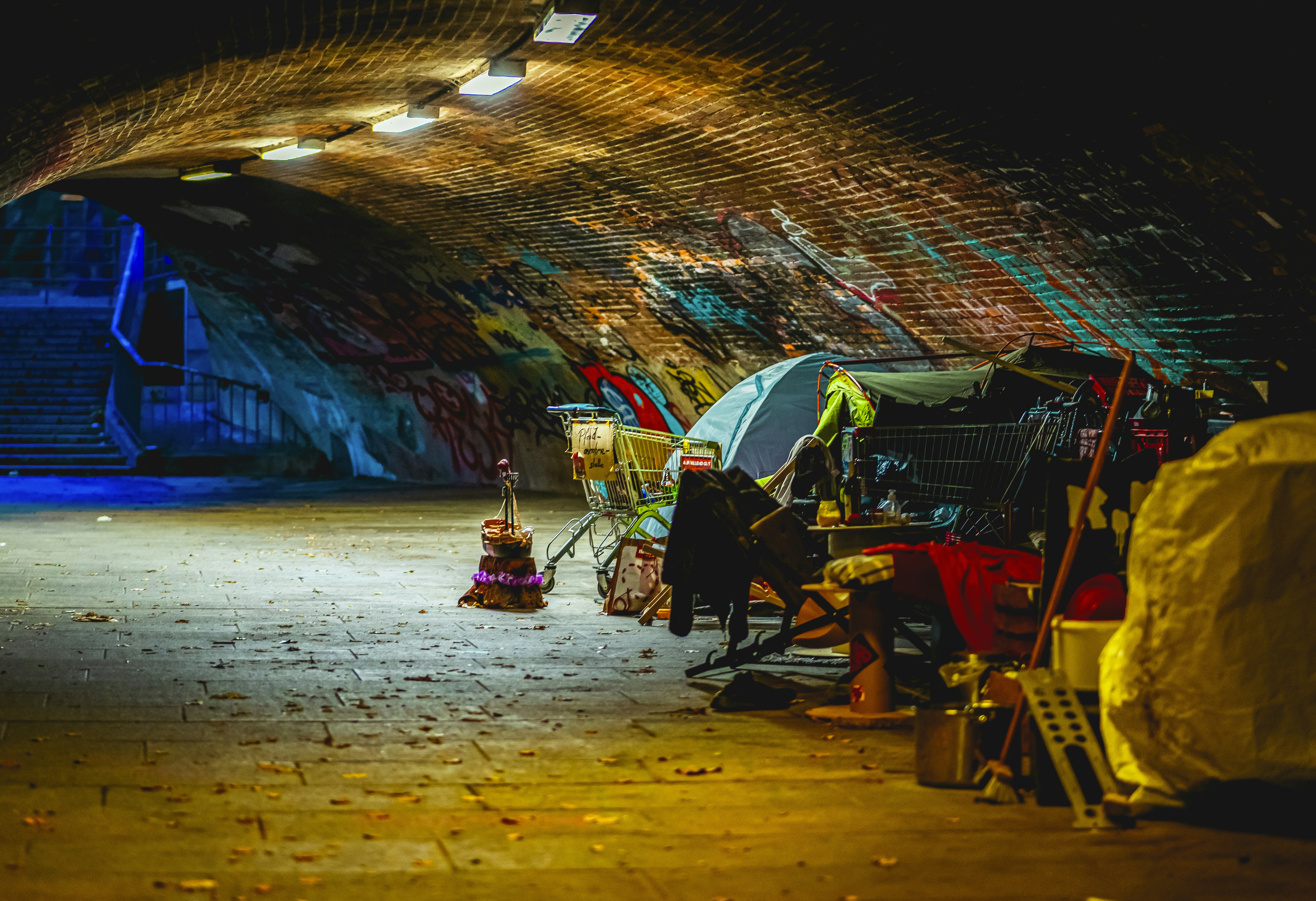 A group of tents sitting inside of a tunnel photo – Free Wallpaper ...
