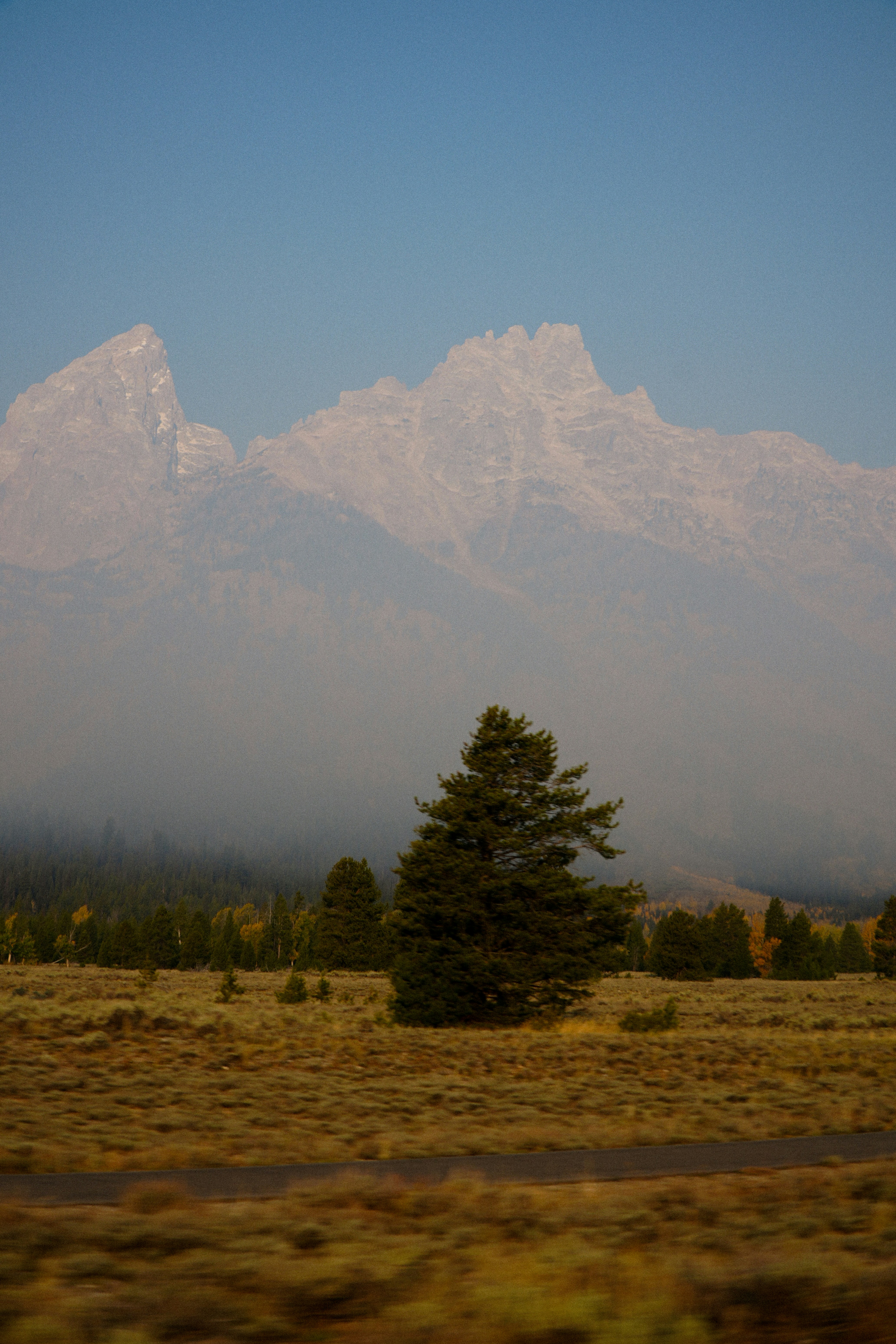 Misty Peaks over a Silent Plains
