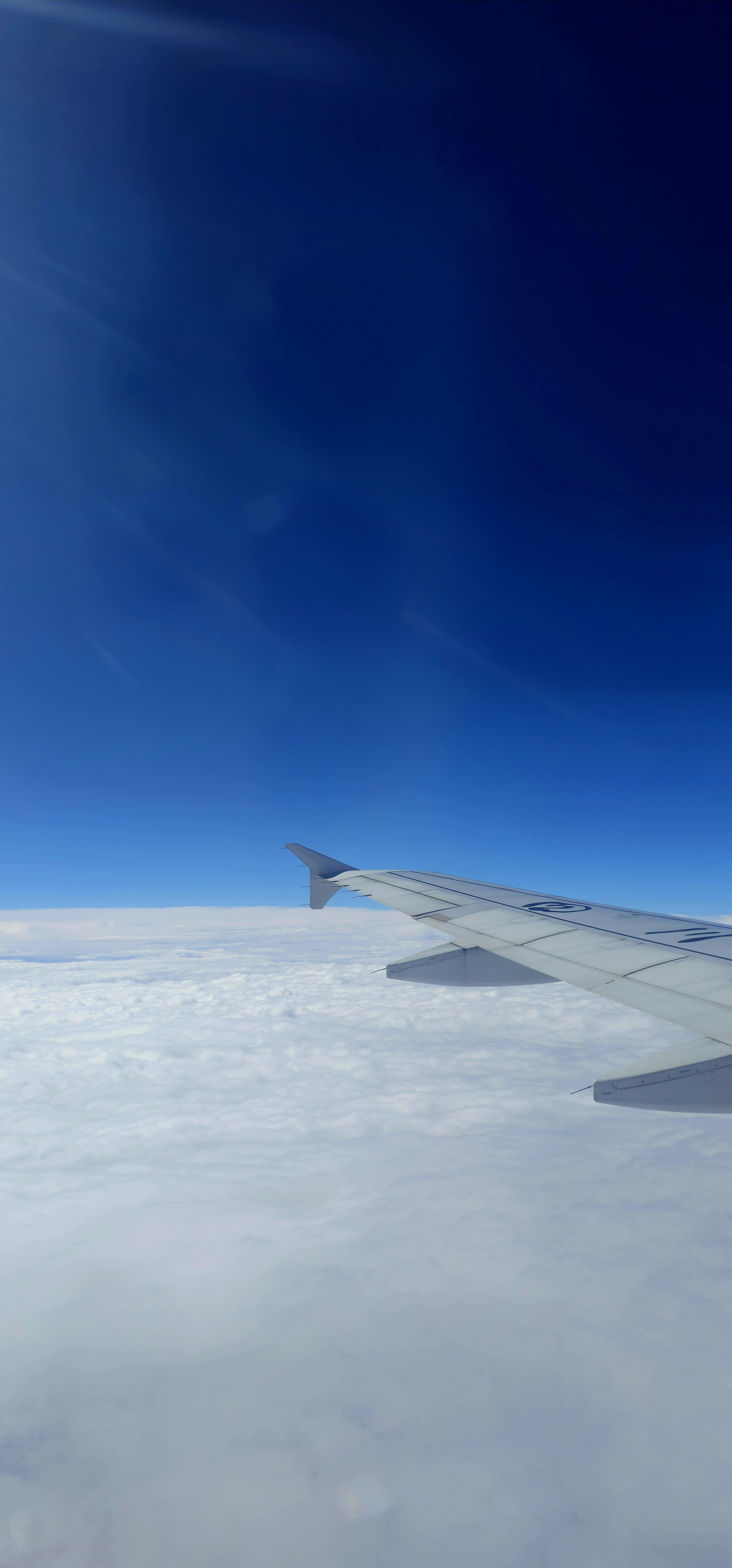 Winglet Over the Clouds: Window-Seat Sky Portrait