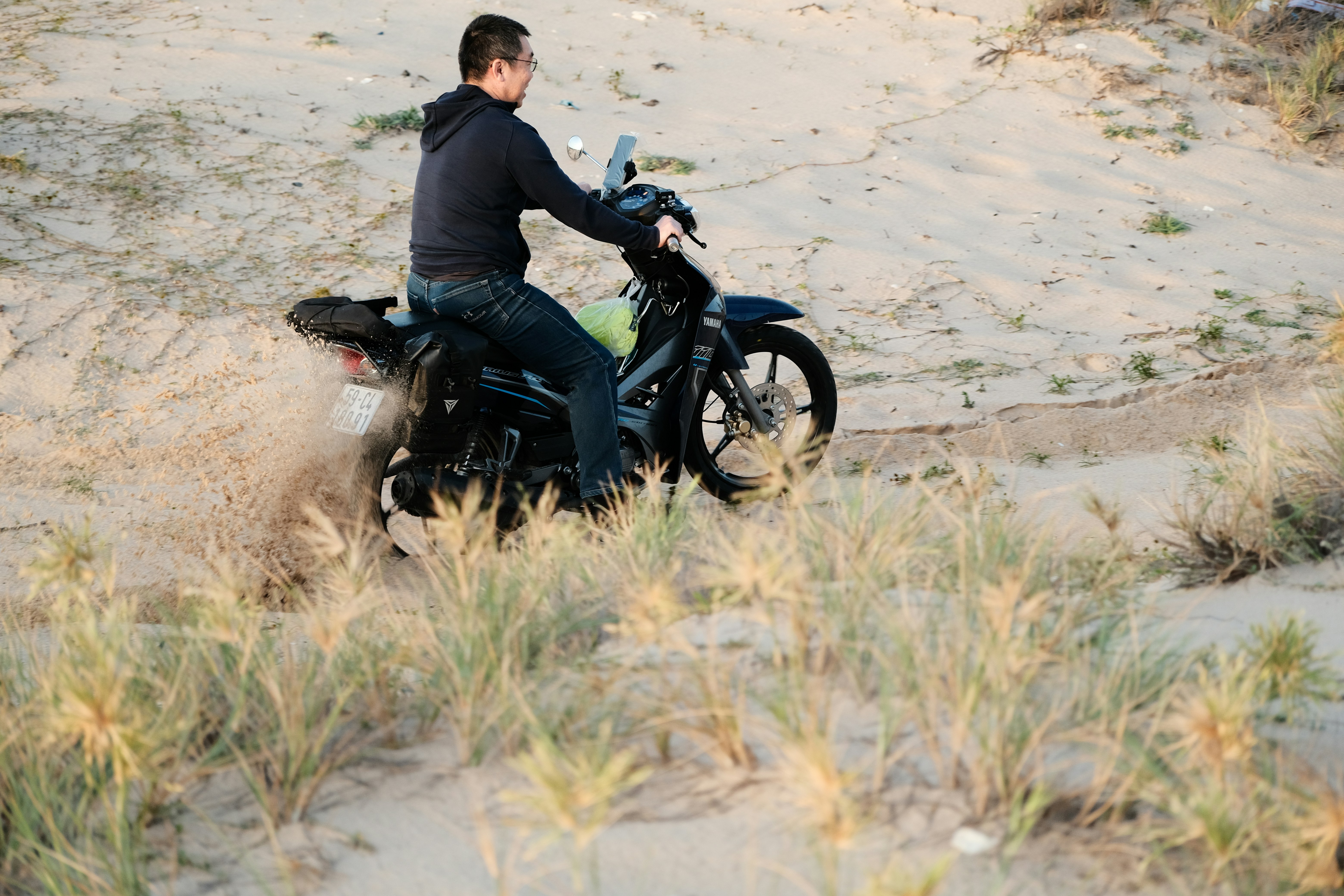 Dust-Swept Descent: A Lone Rider Conquers Wind-Swept Dunes