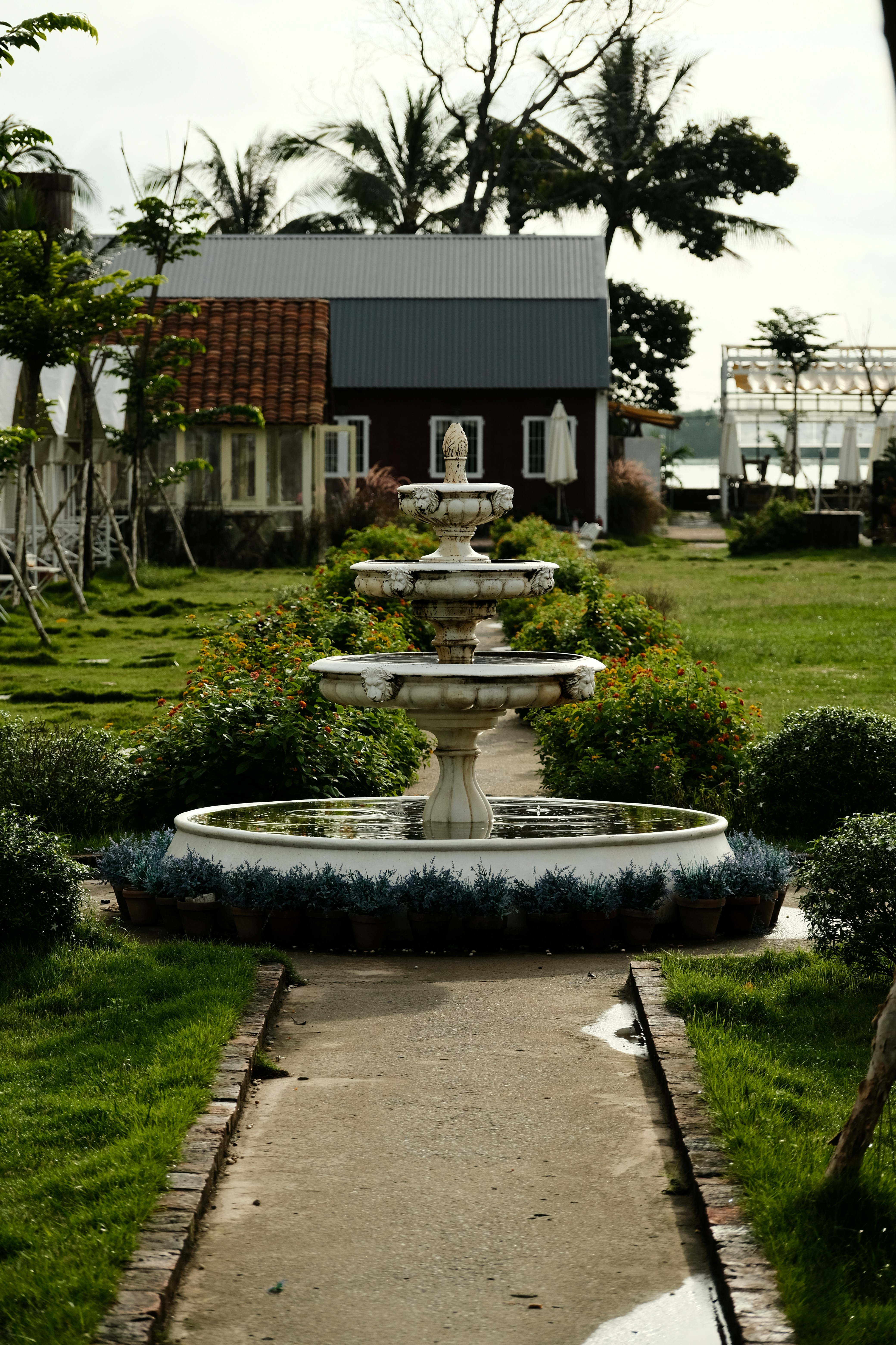 Tiered Fountain Centerpiece Framed by a Quiet Garden Path