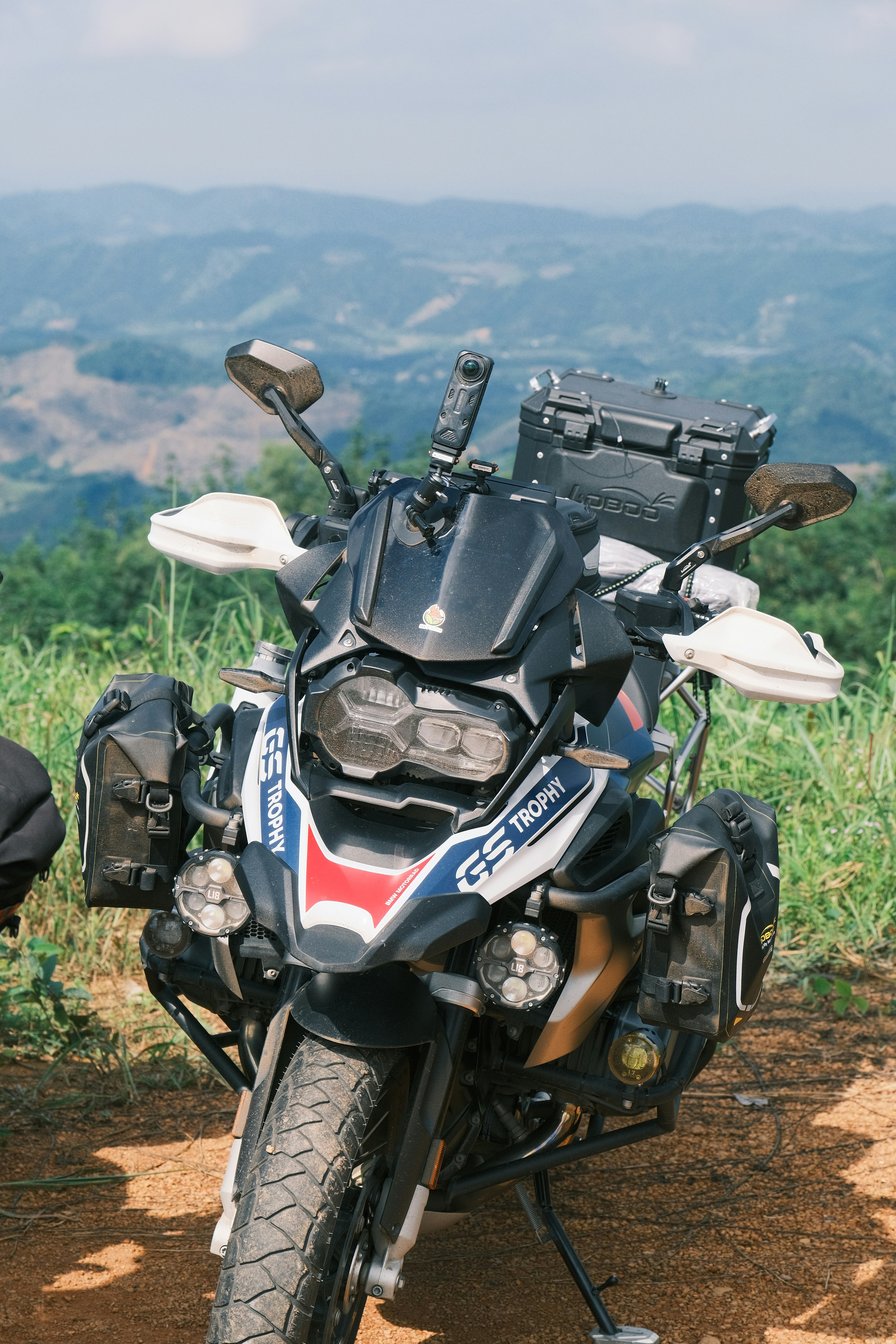 Ridge-Top Dual-Sport: A Fully Laden Adventure Bike Overlooking the Hills