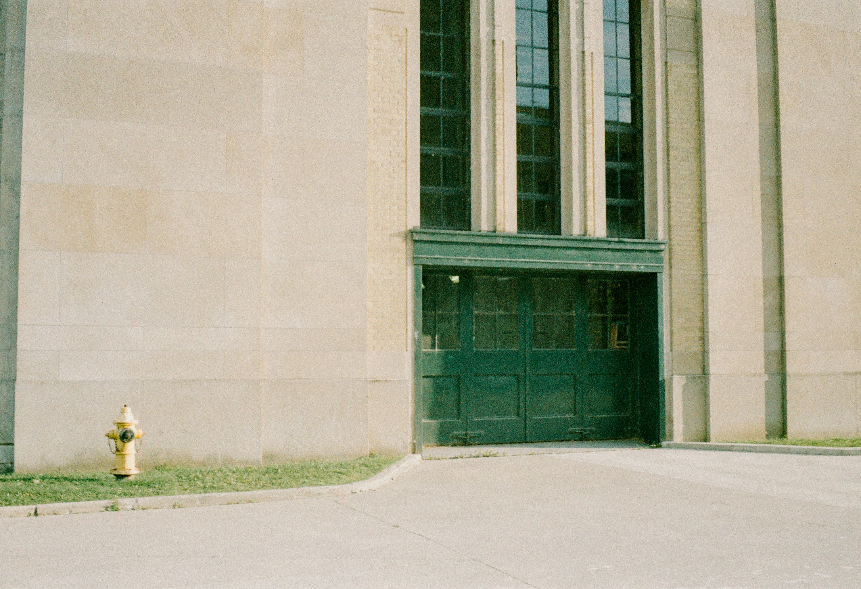 A fire hydrant in front of a large building photo – Free Canada Image ...