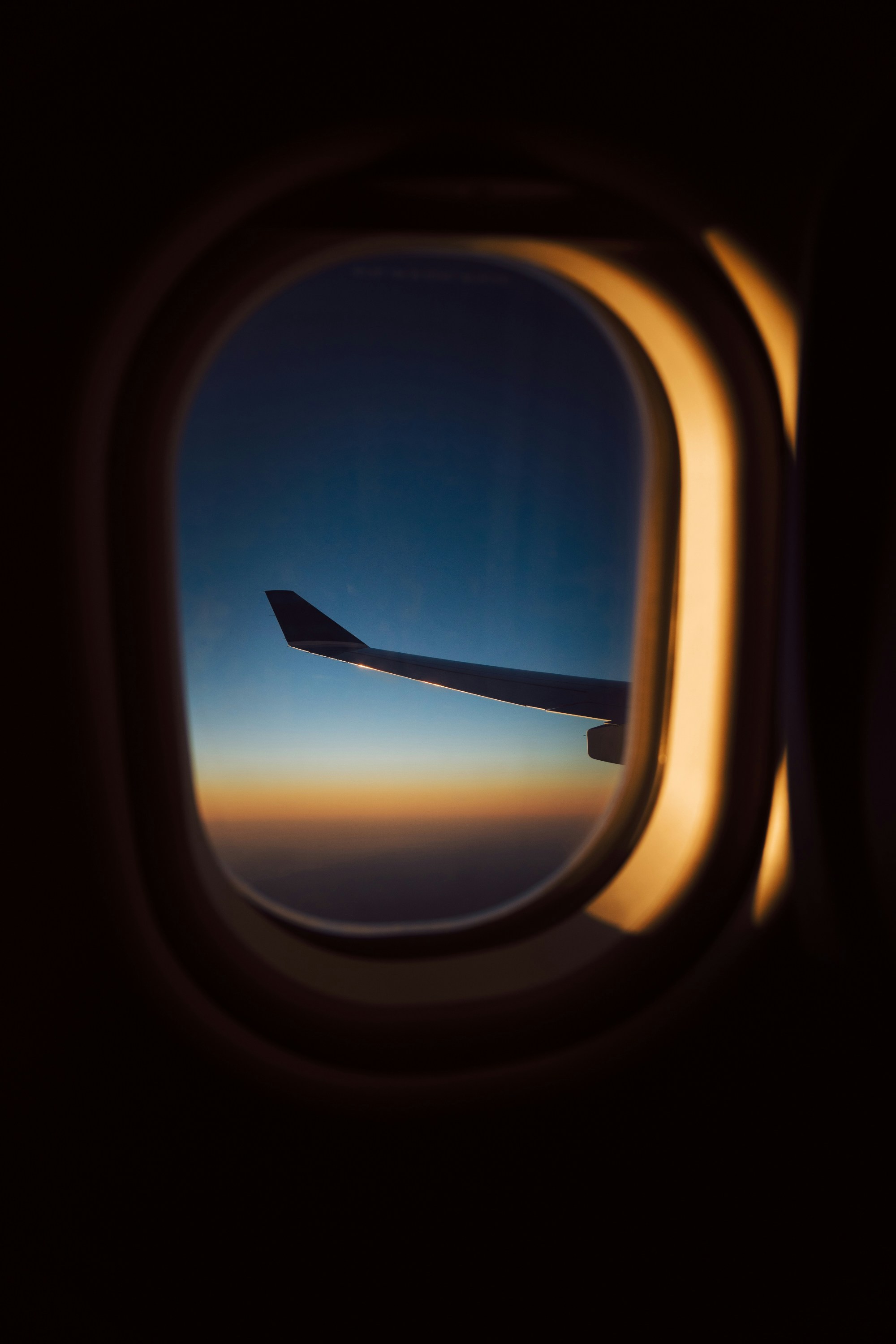 A view of the wing of an airplane through a window photo – Free Aerial ...