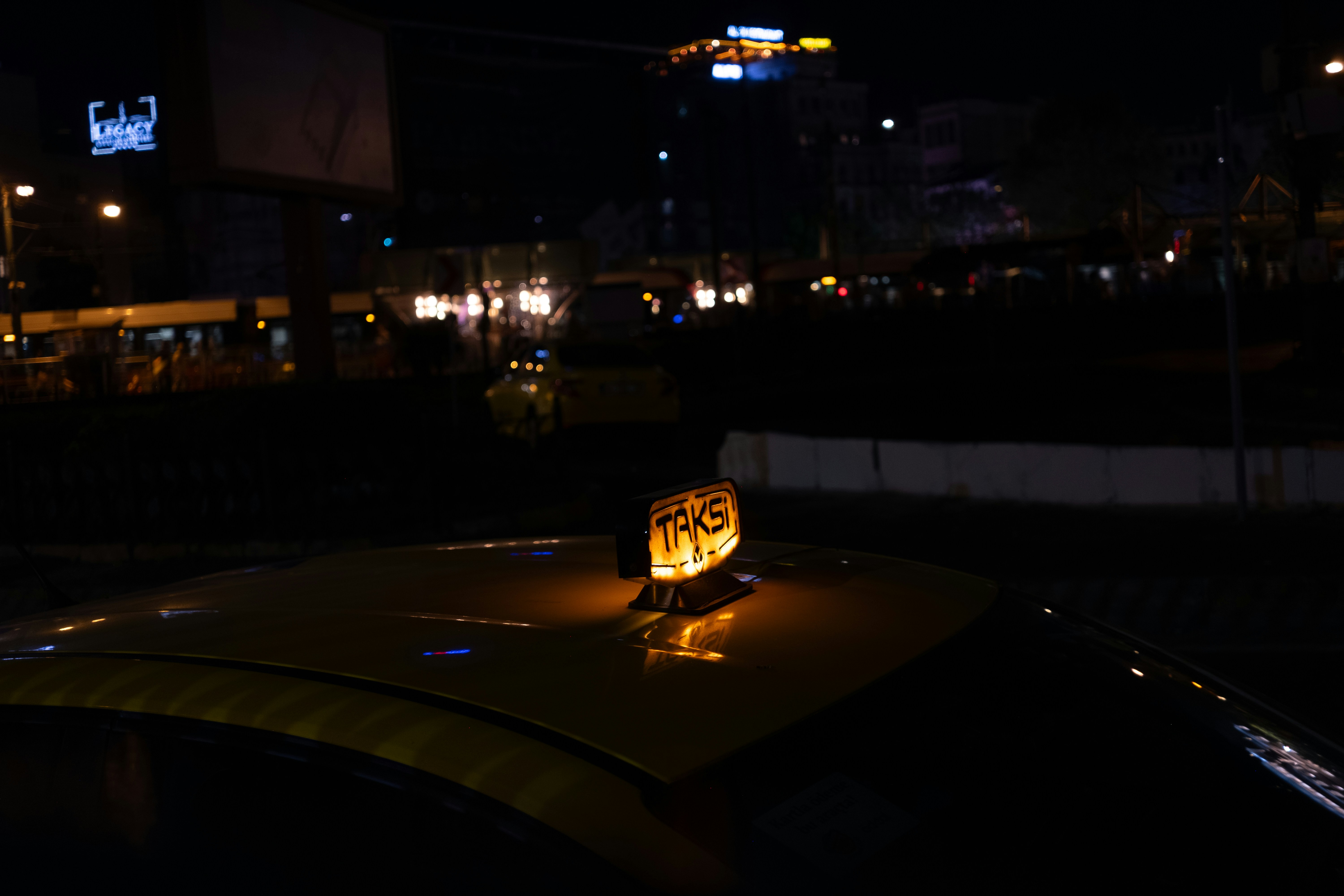 Neon Beacon on a Night Taxi Roof