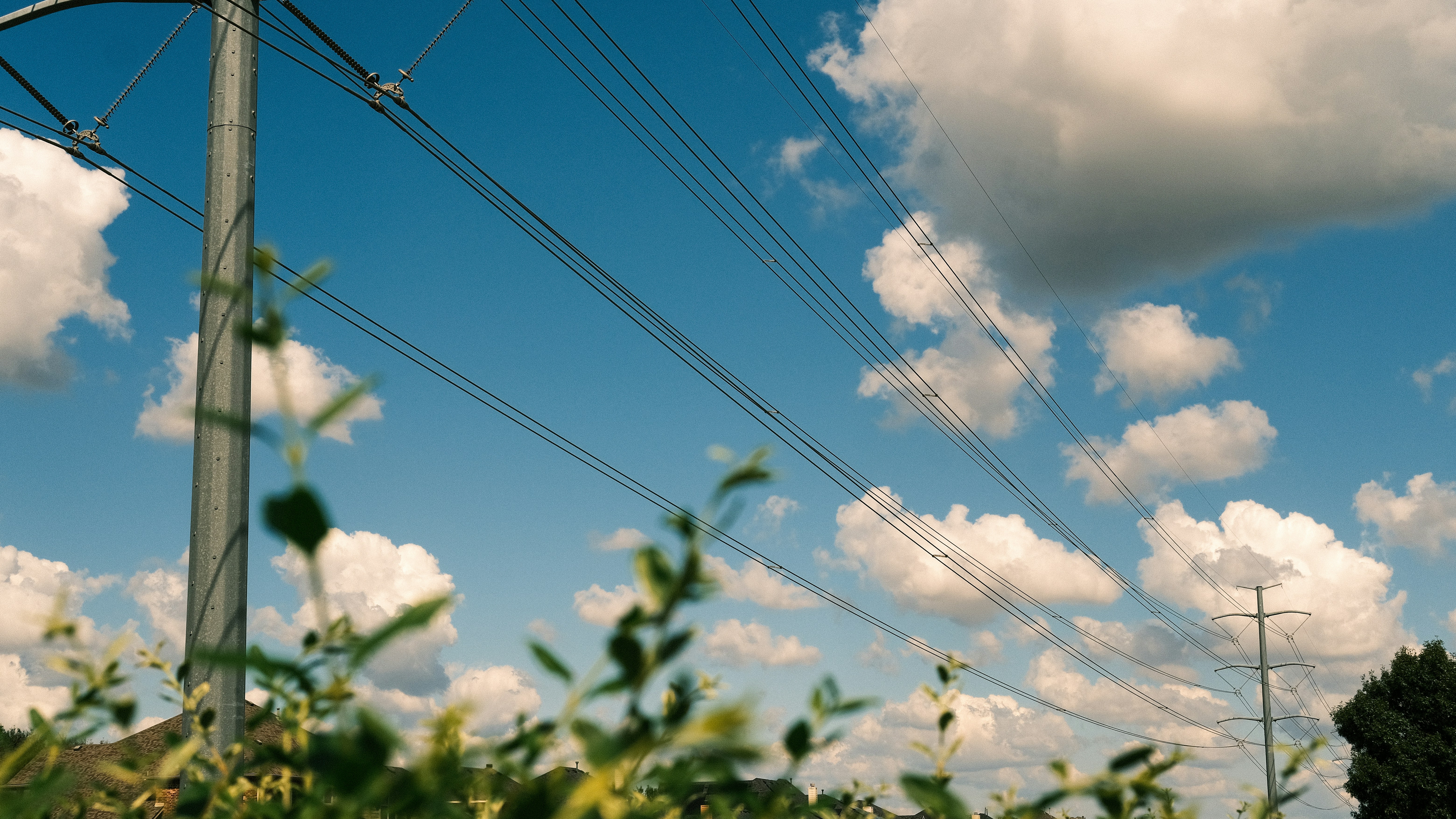 Lattice of Light: A Lone Pole Traverses a Cloud-Swept Sky