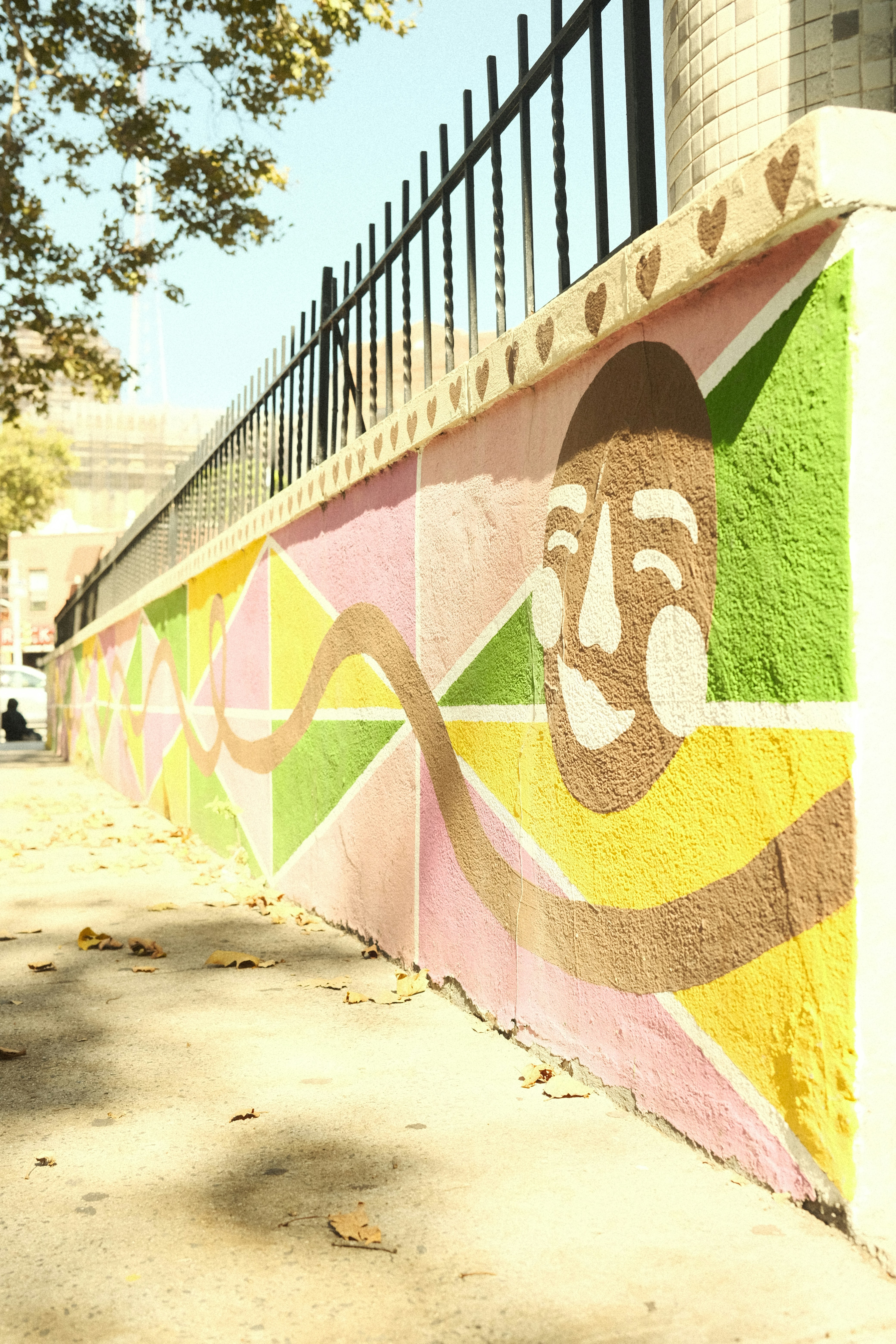 Ribbons of Color Along a Sunlit City Wall