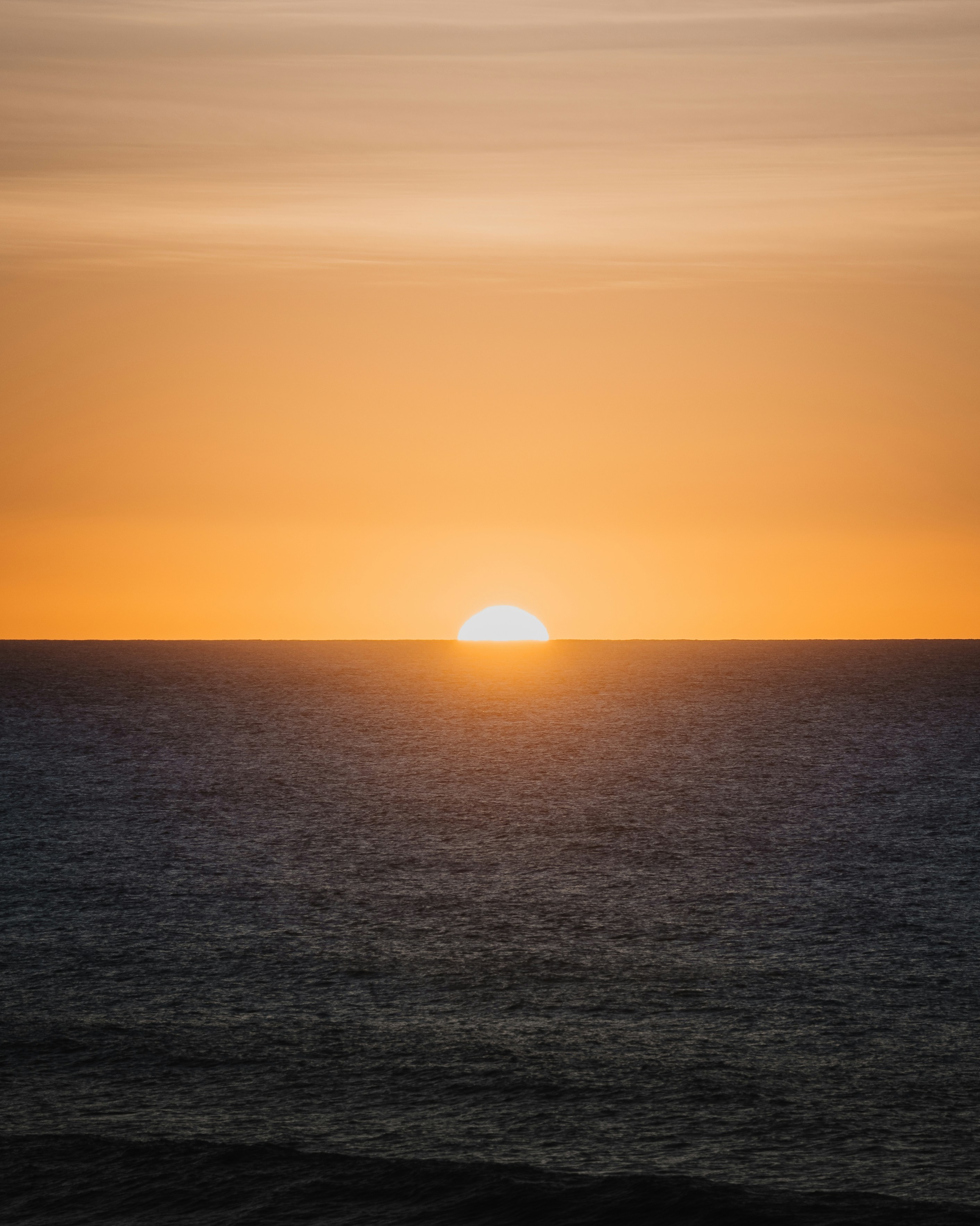 The sun is setting over the ocean on a cloudy day photo – Free Imsouane ...