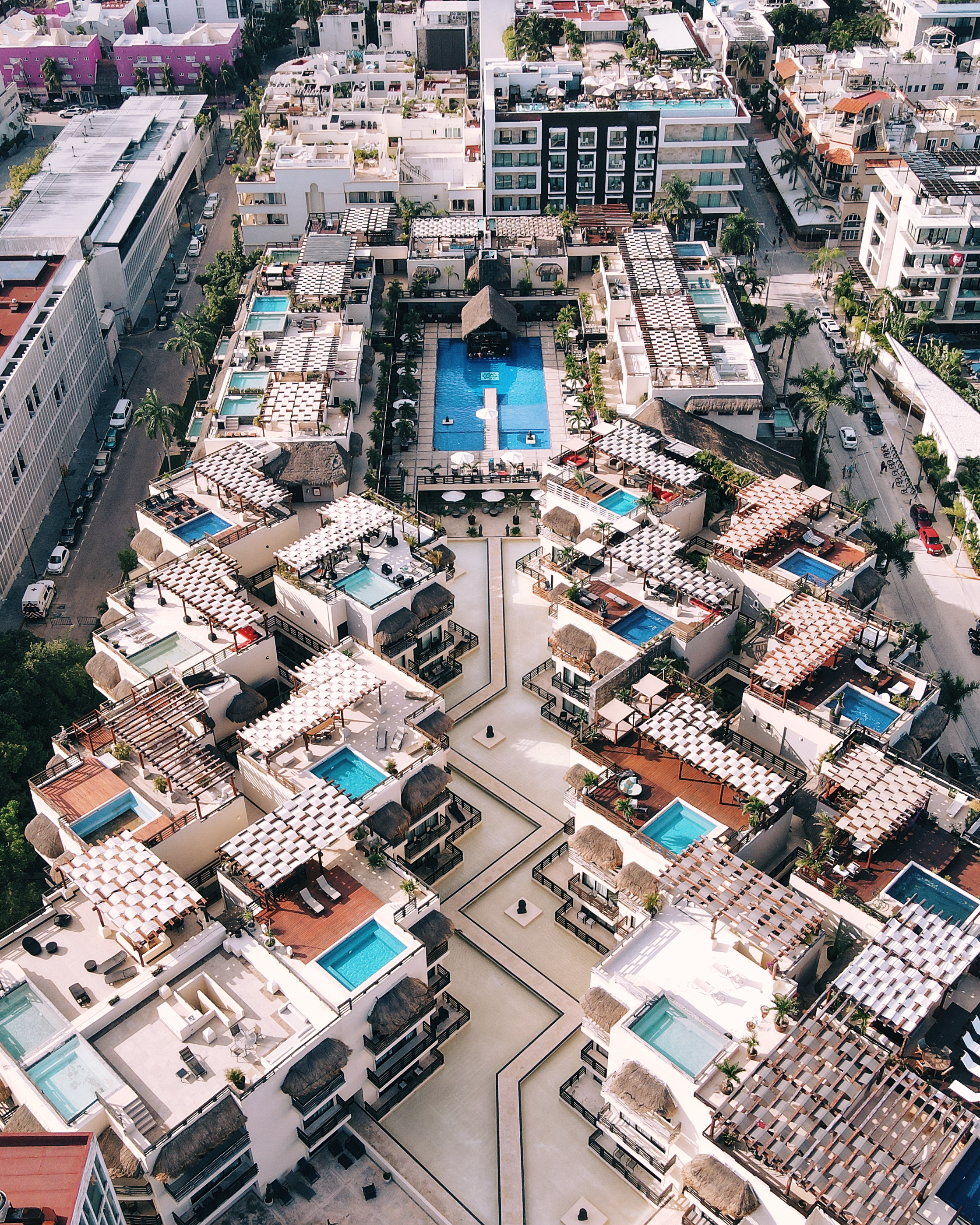 An aerial view of a city with a pool photo – Free Hilton hotel Image on ...