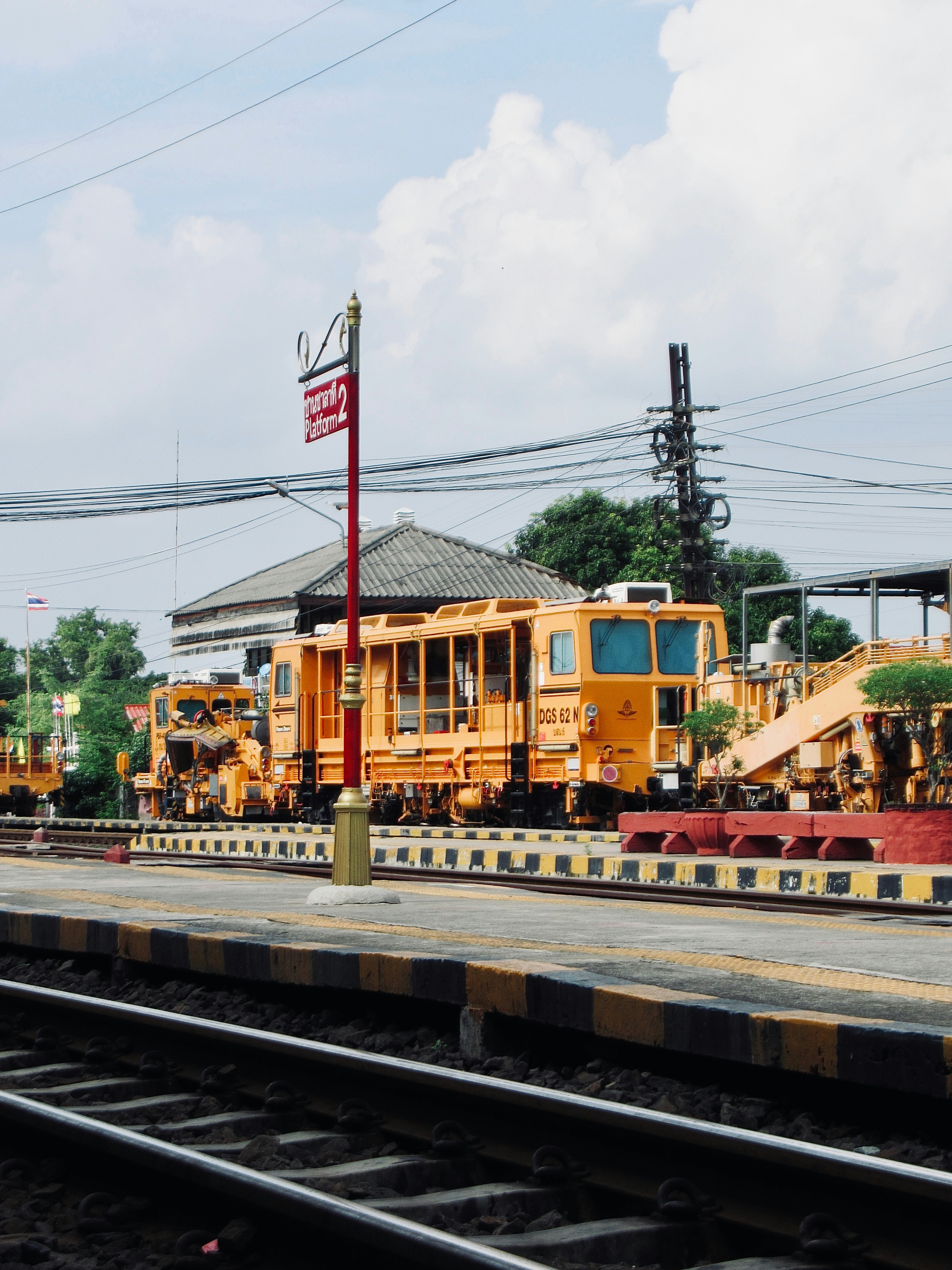 Yellow Maintenance Train at a Quiet Station