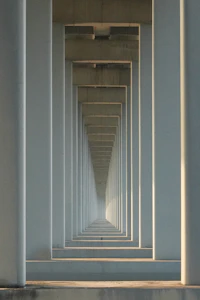 Vanishing Frames: Receding Pillars in a Concrete Corridor