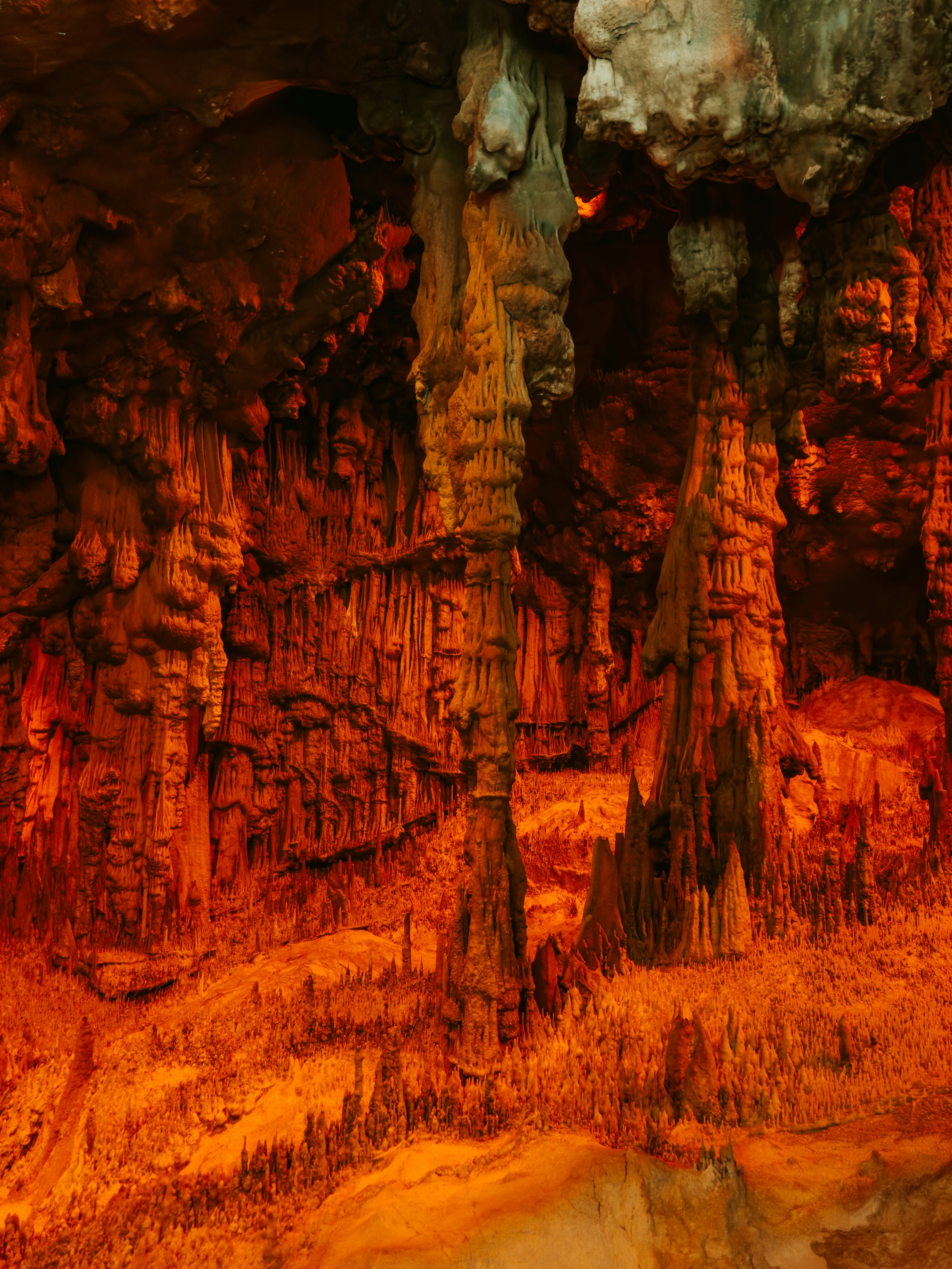 A cave filled with lots of tall rocks photo – Free Dark Image on Unsplash