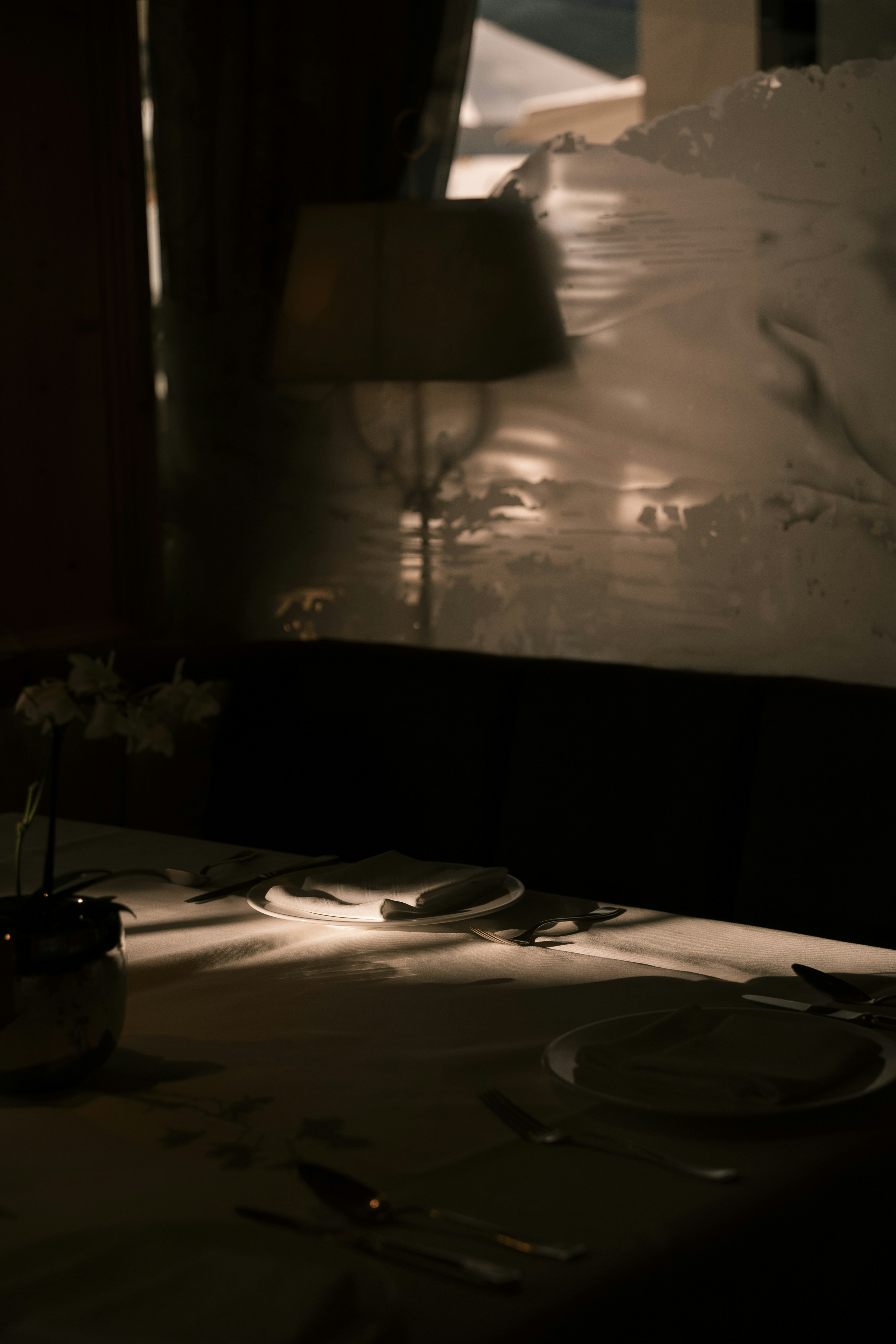 Restaurant setup at a five star restaurant. | A room with a bed and a night stand