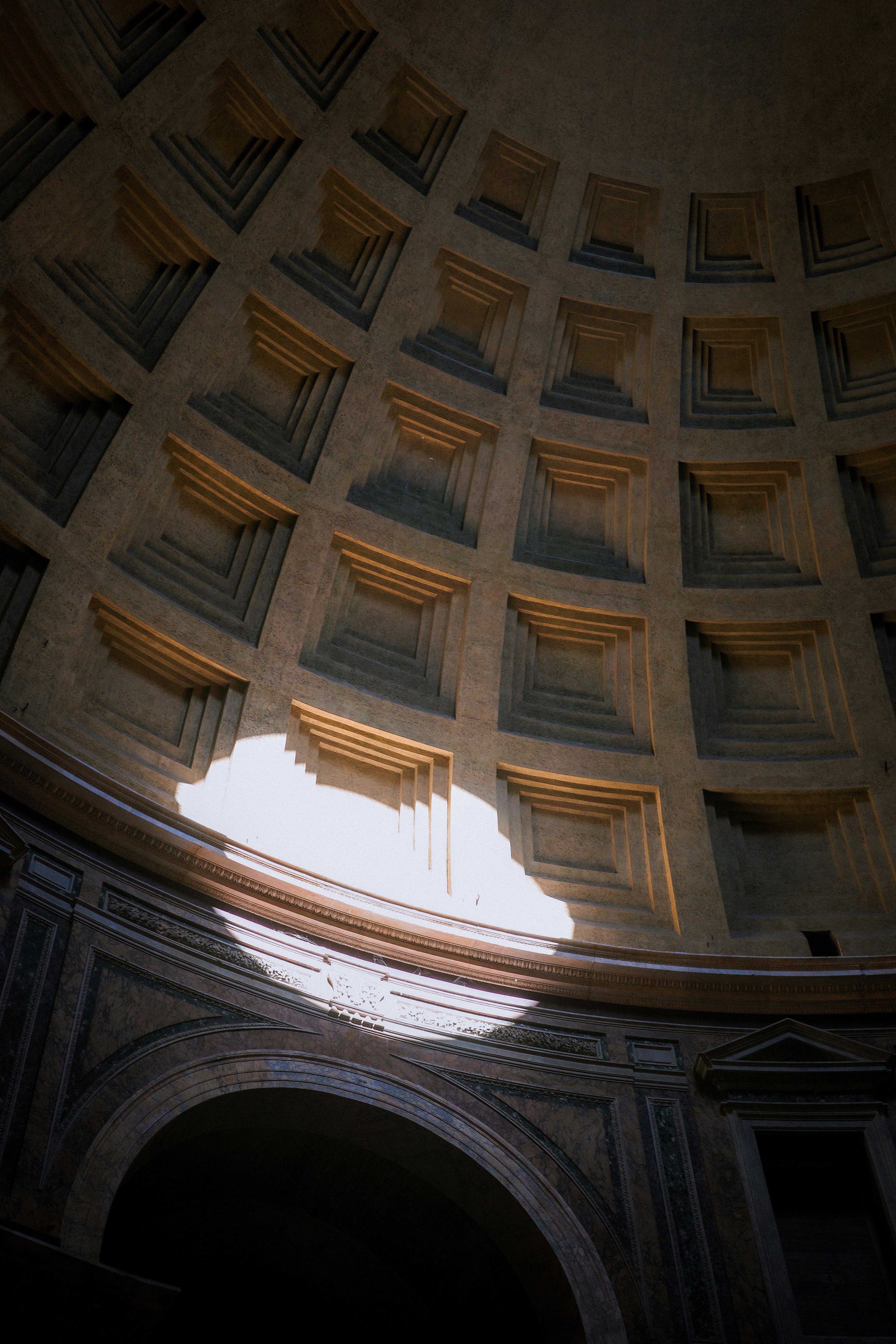 The sun is shining through the windows of a building photo – Free ...