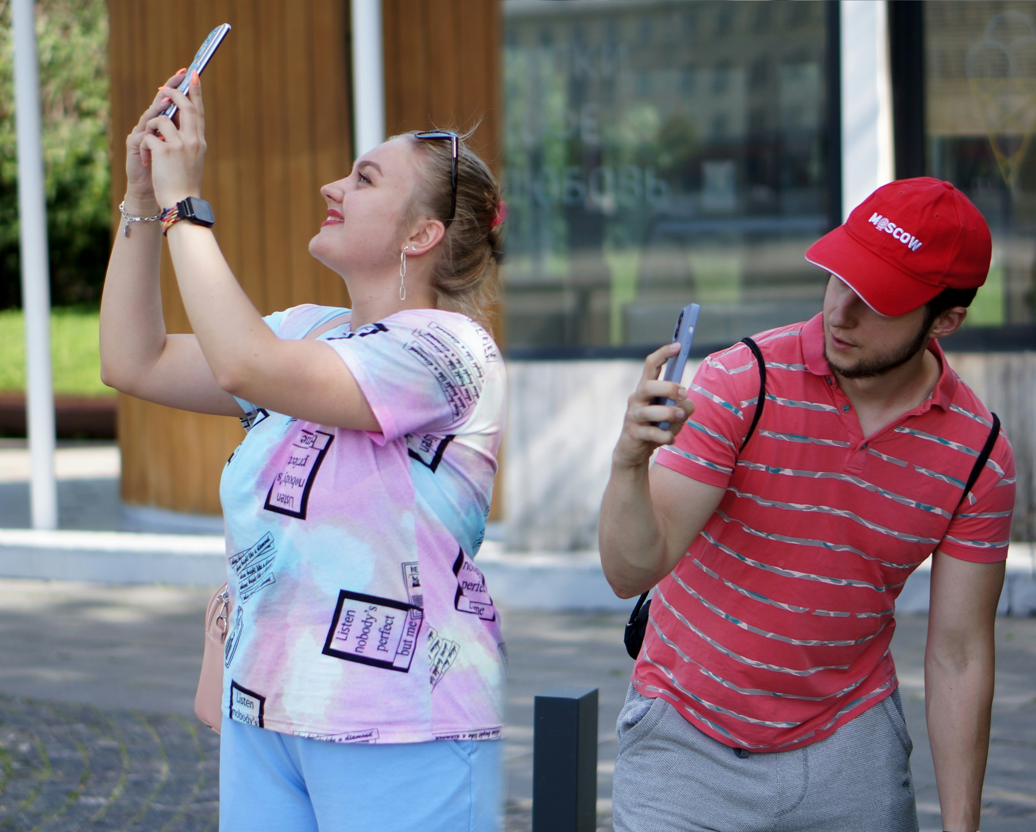 Two Friends, One Selfie: A Sunlit Street Moment
