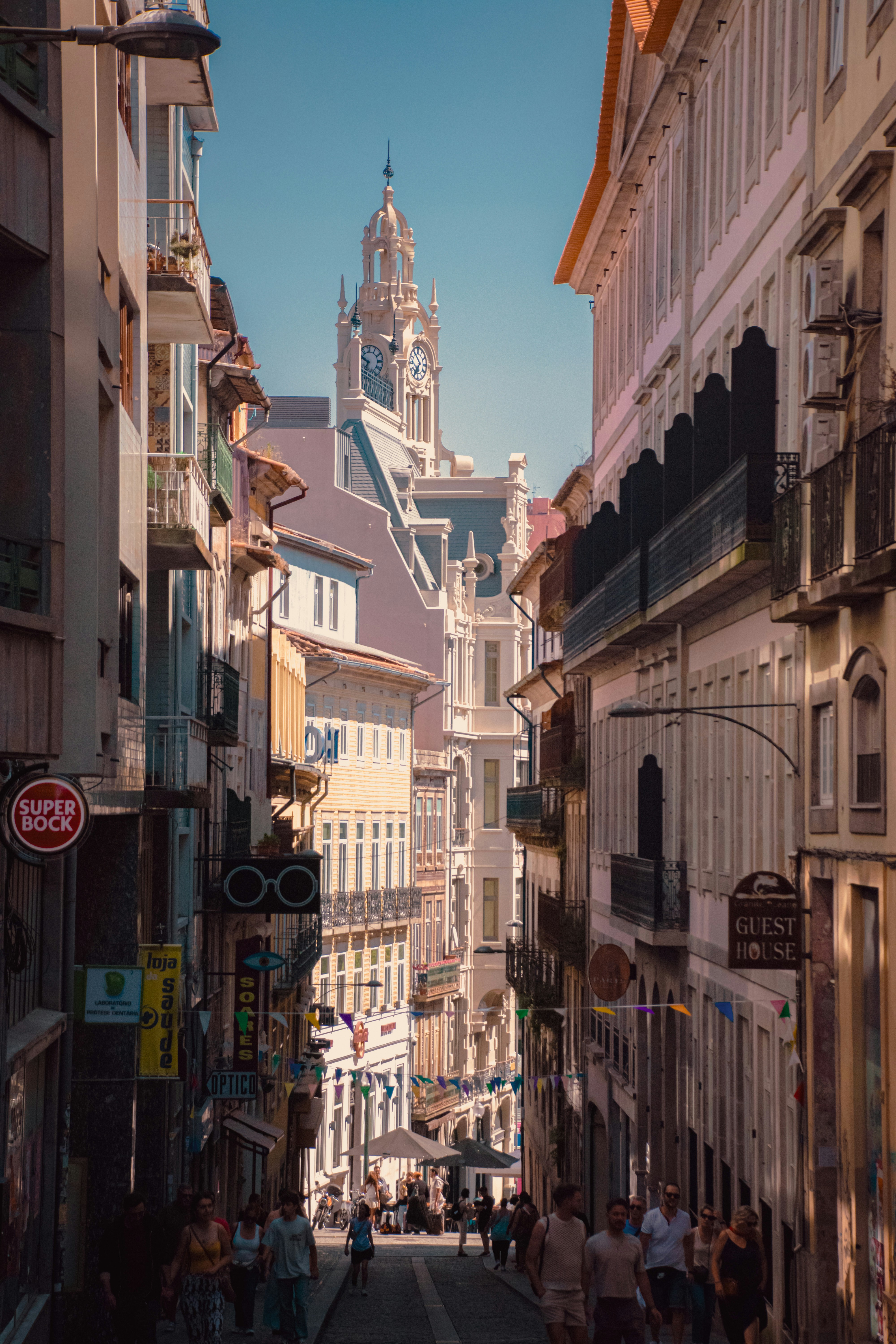 A narrow city street lined with tall buildings photo – Free Porto Image ...