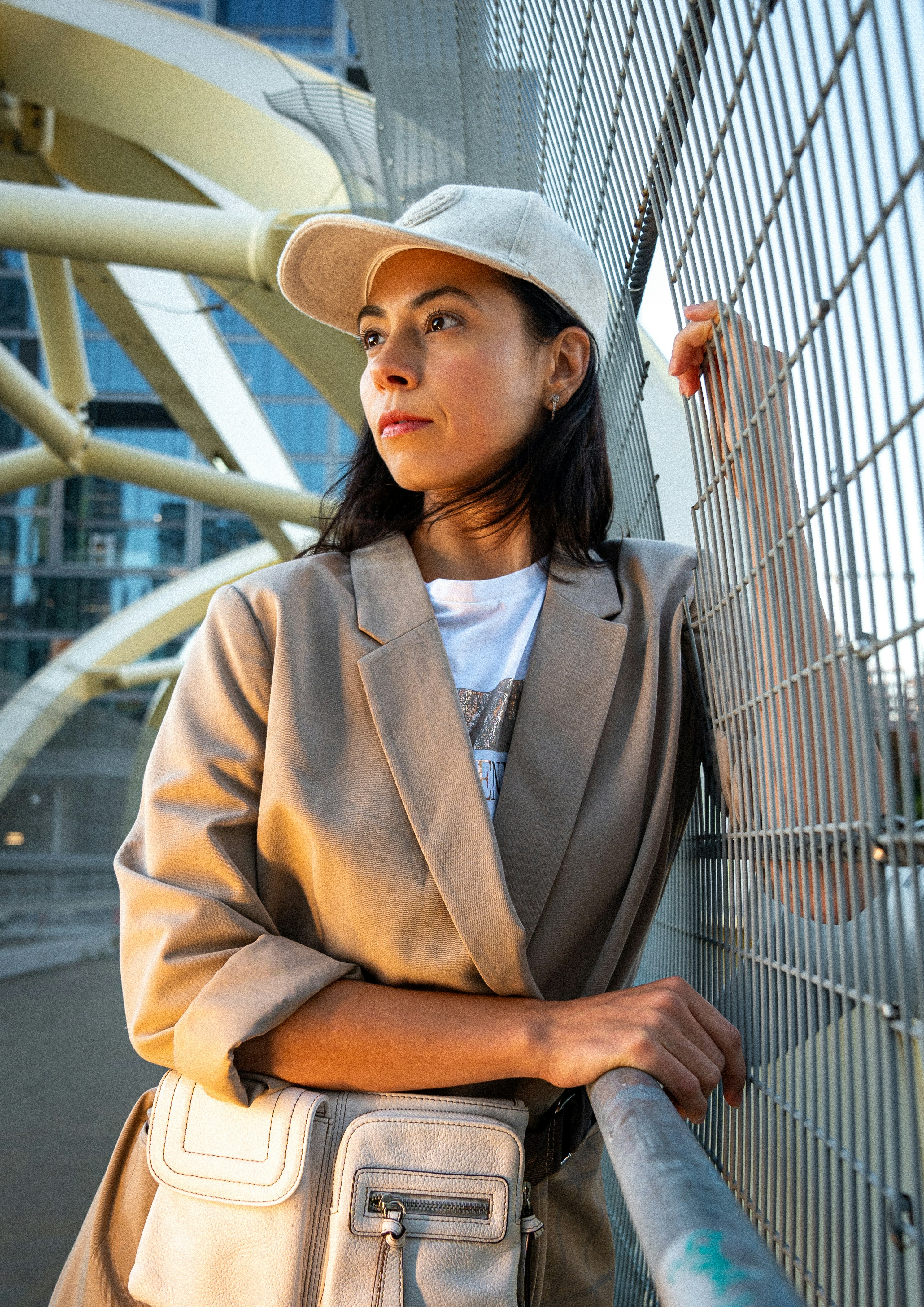 Portrait at the Edge: A City Bridge Moment in Soft Light