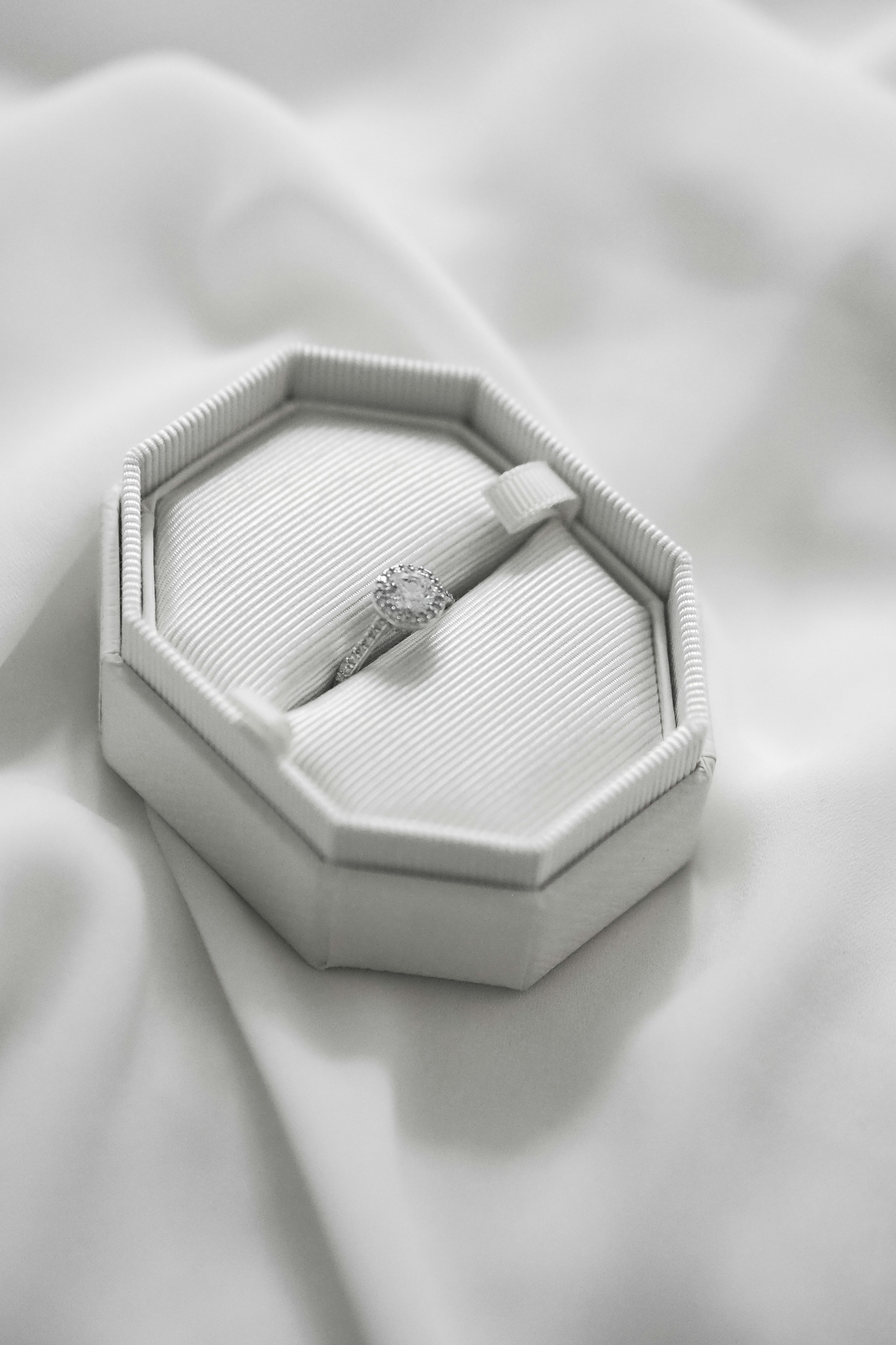 A white ring box with a diamond on top of it photo – Free Accessories ...