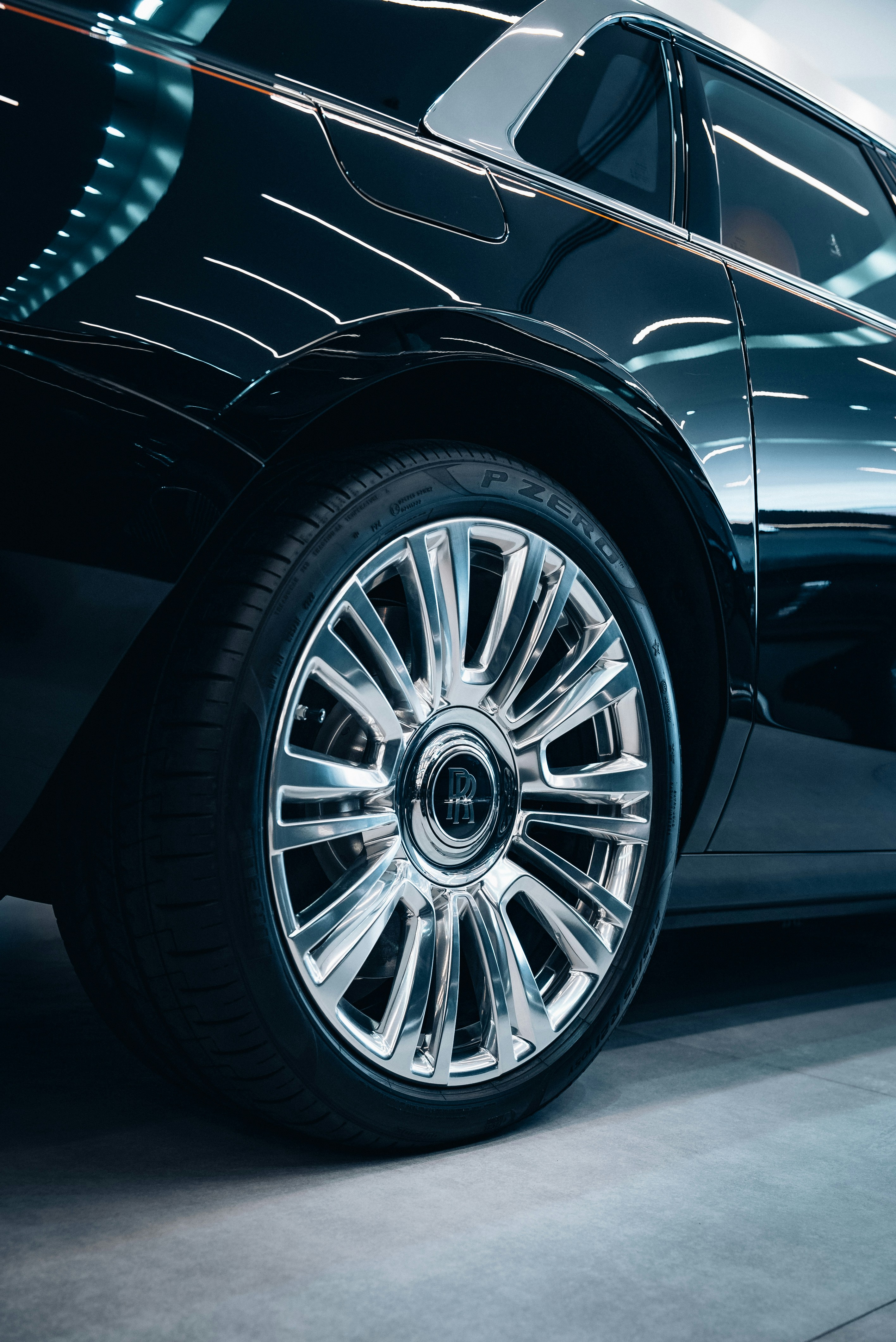 A black car with chrome rims parked in a garage photo – Free Dubai ...