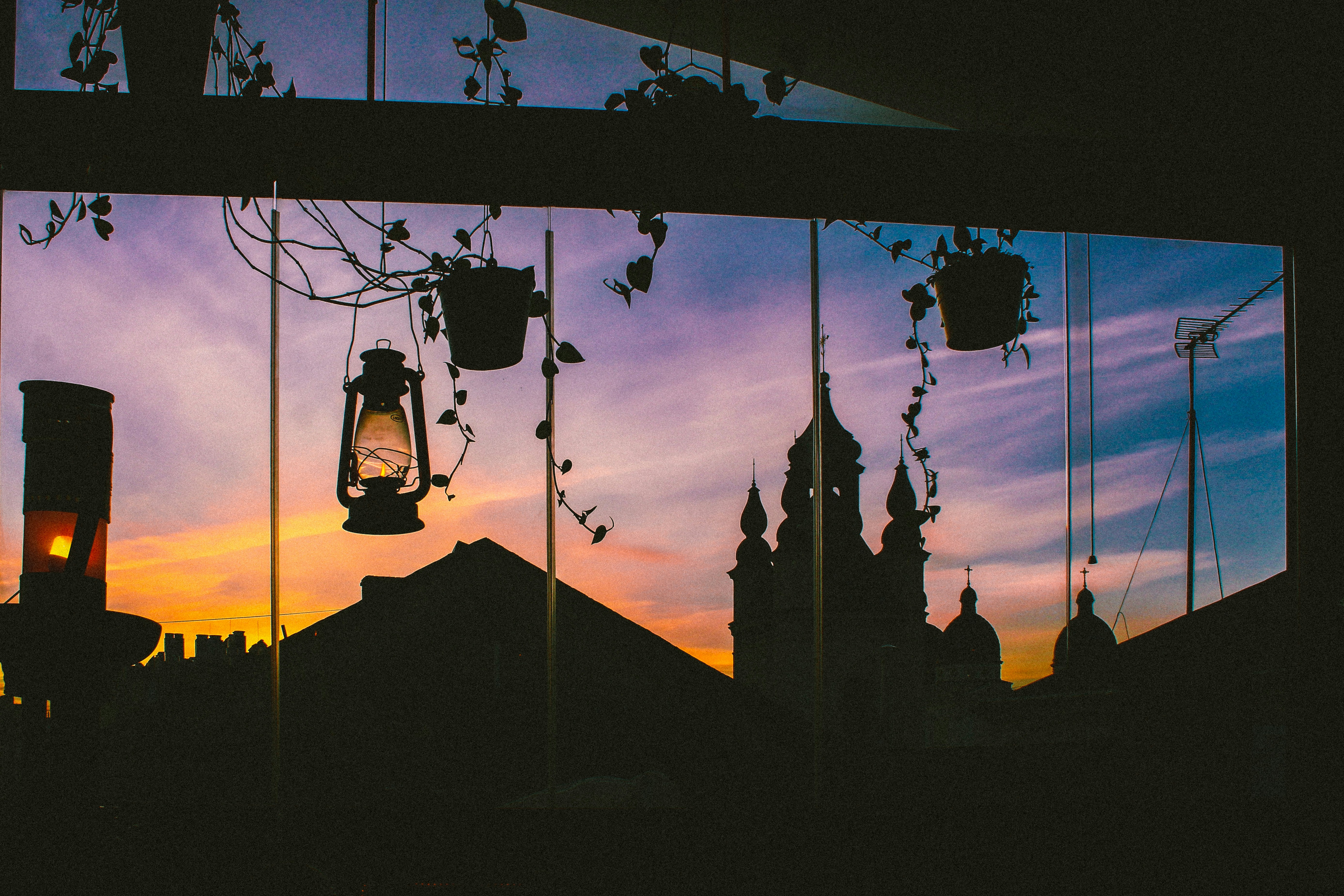 A view of a sunset through a window photo – Free Silhouette Image on ...