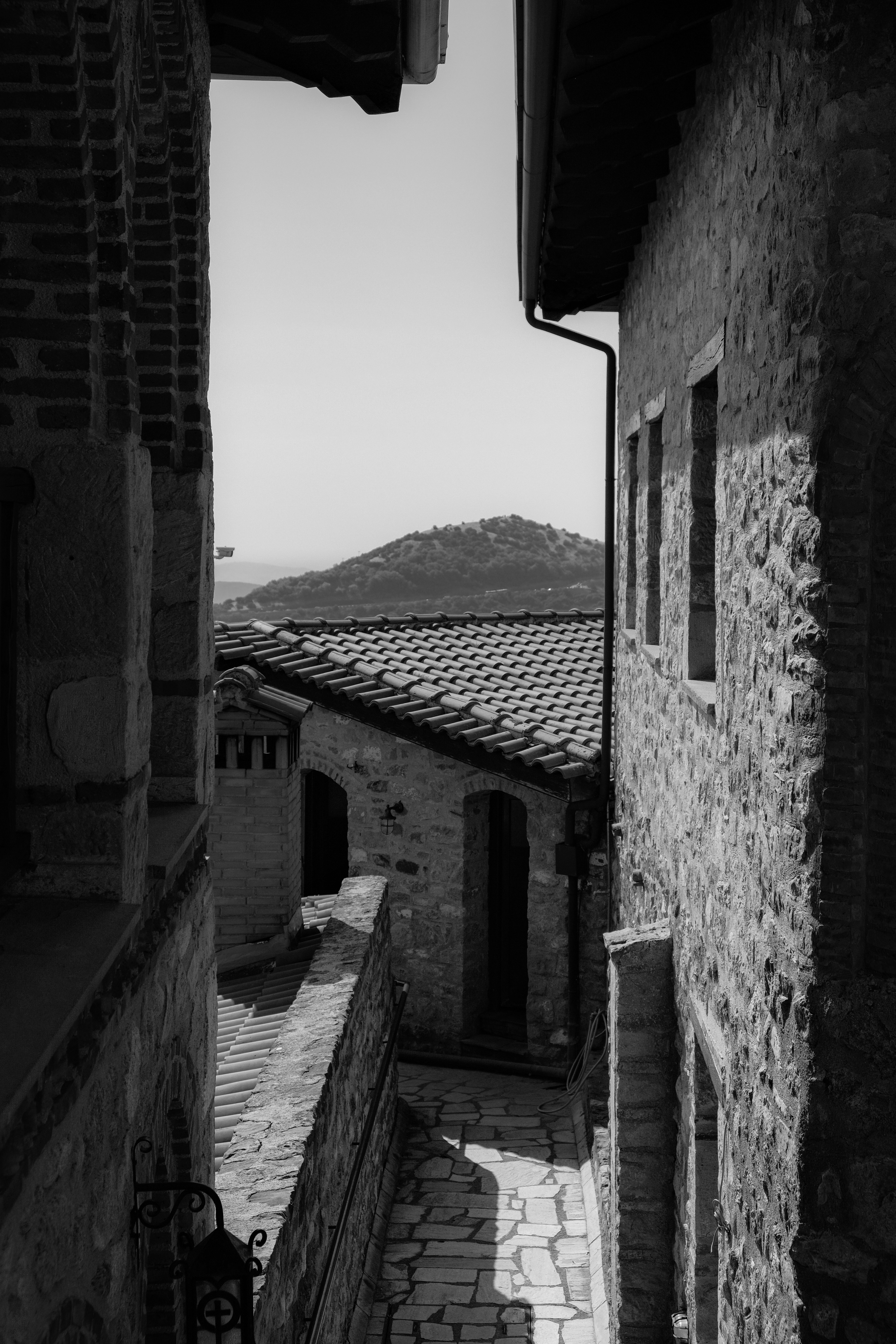 A black and white photo of an alley way photo – Free Meteora Image on ...