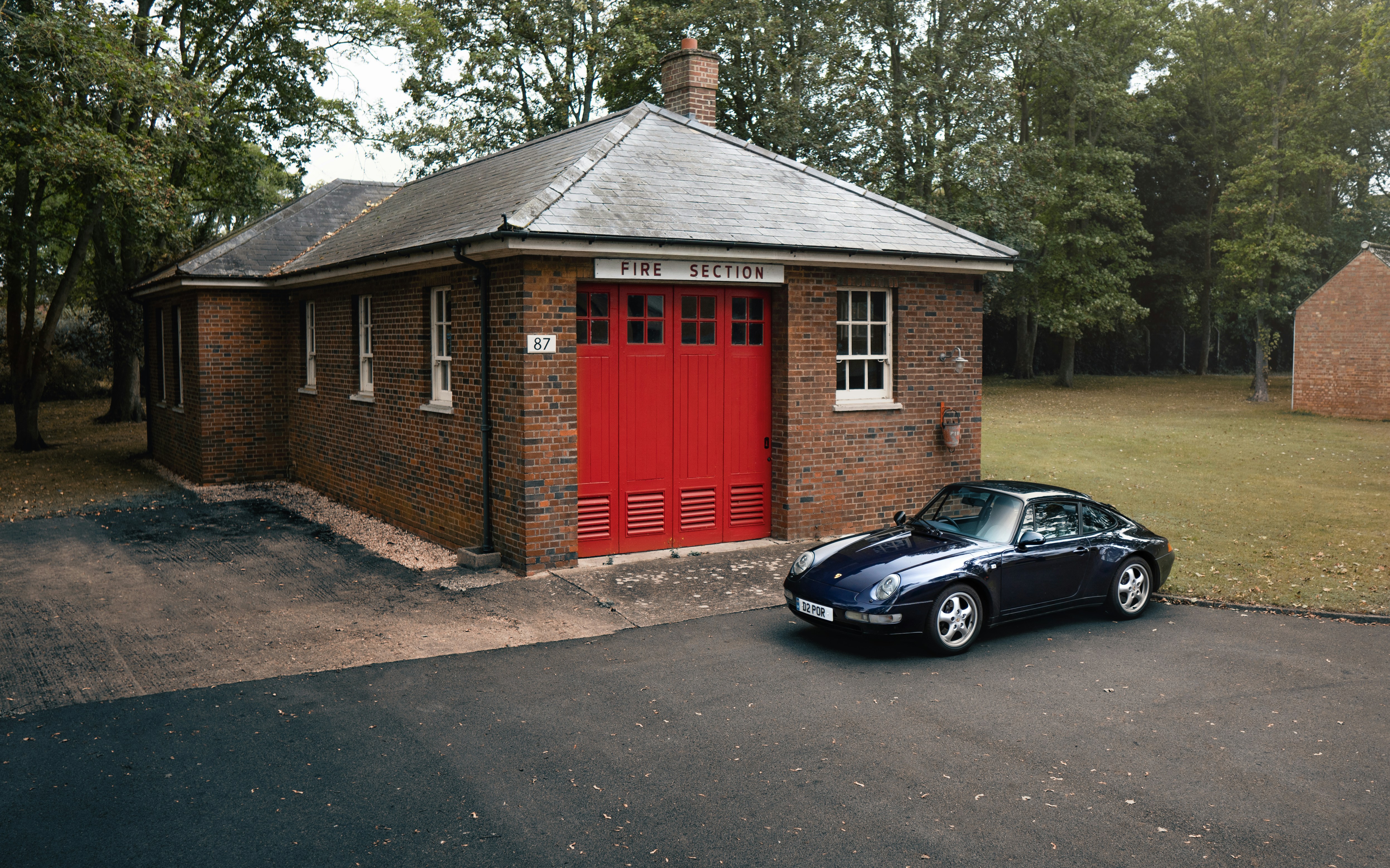 A car parked in front of a brick building photo – Free Bicester ...