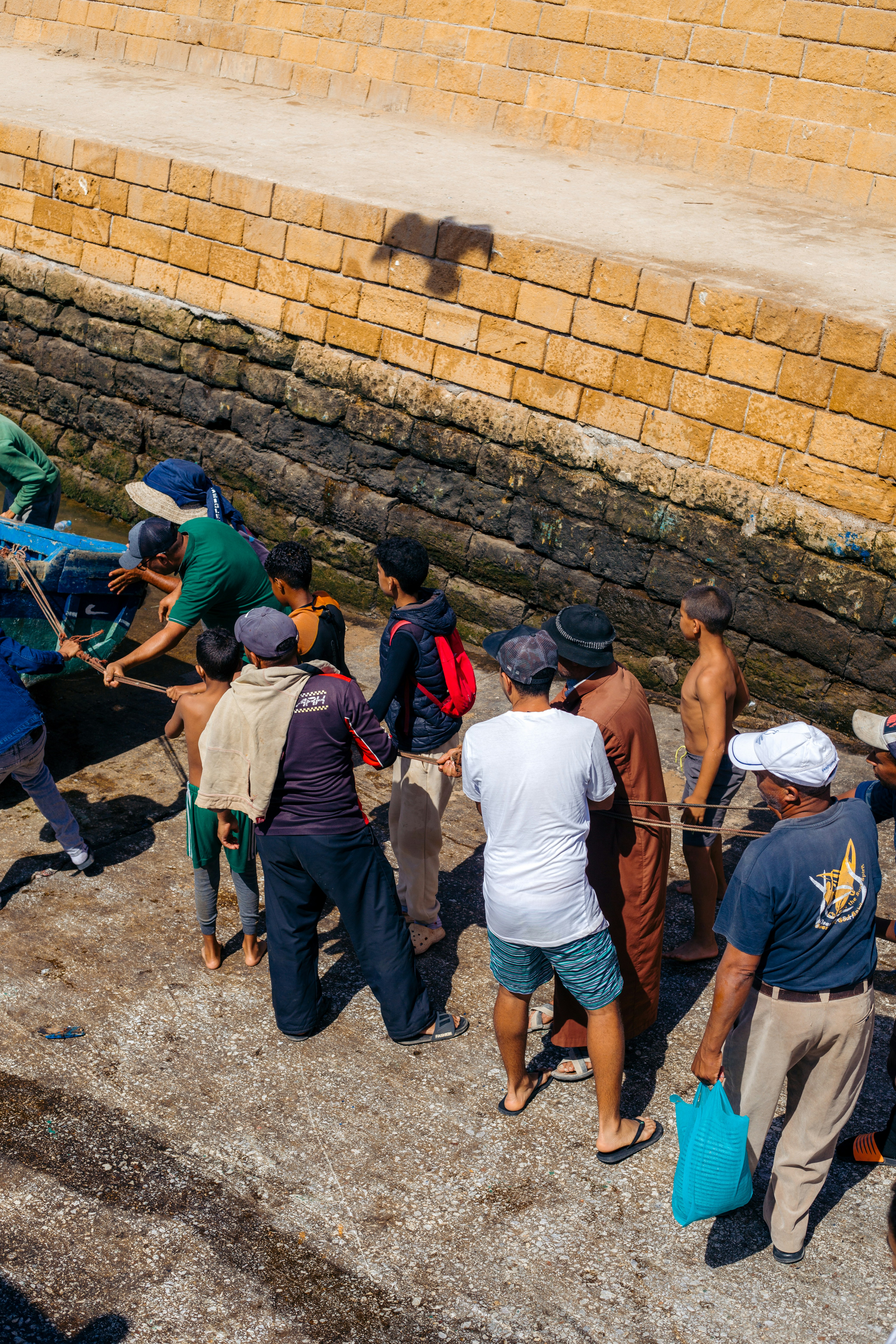 Quay Line Convergence: Tension and Teamwork Elevating a Tide-Worn Wall
