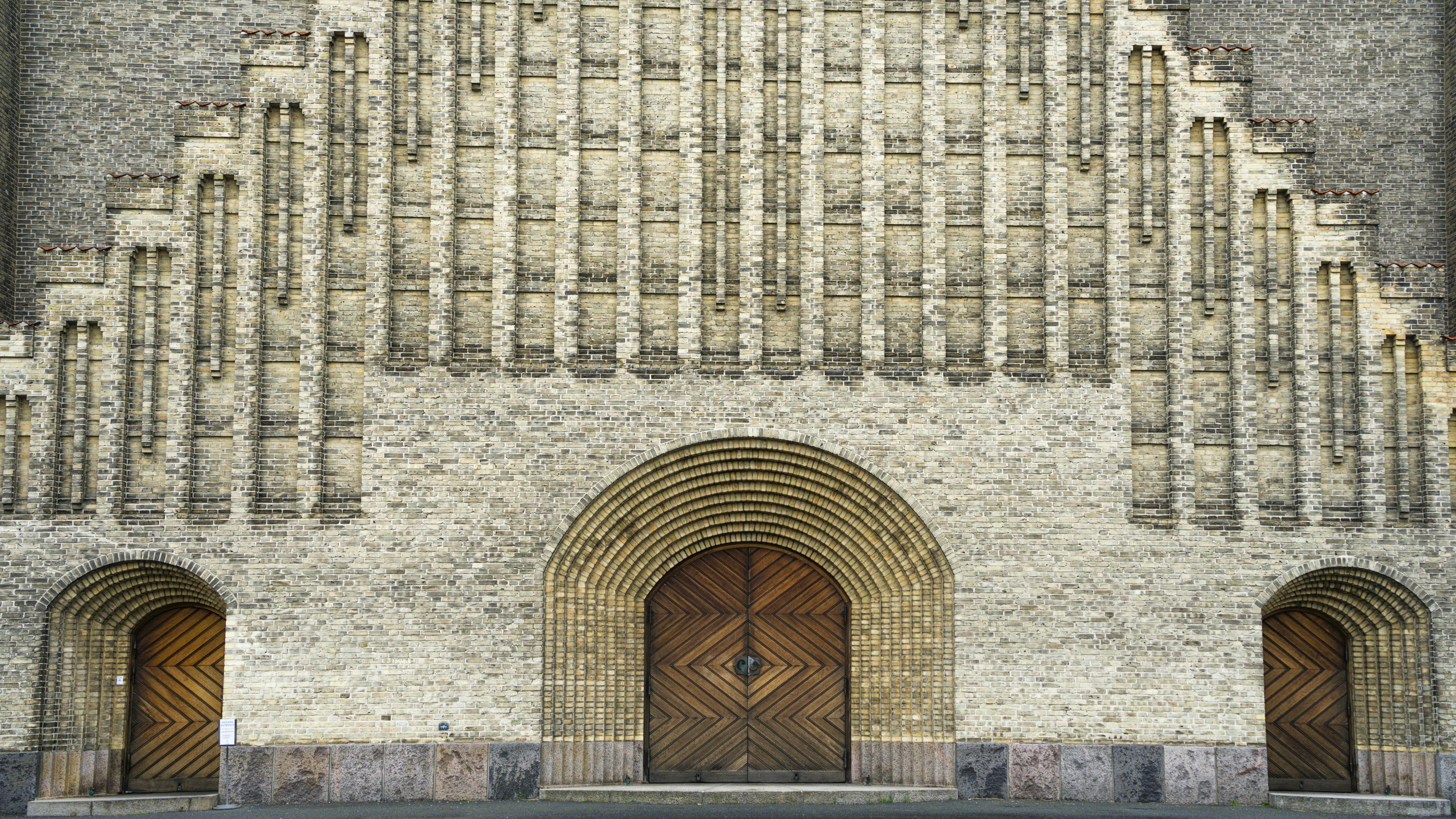 The Central Portal: Symmetry in a Terraced Brick Facade