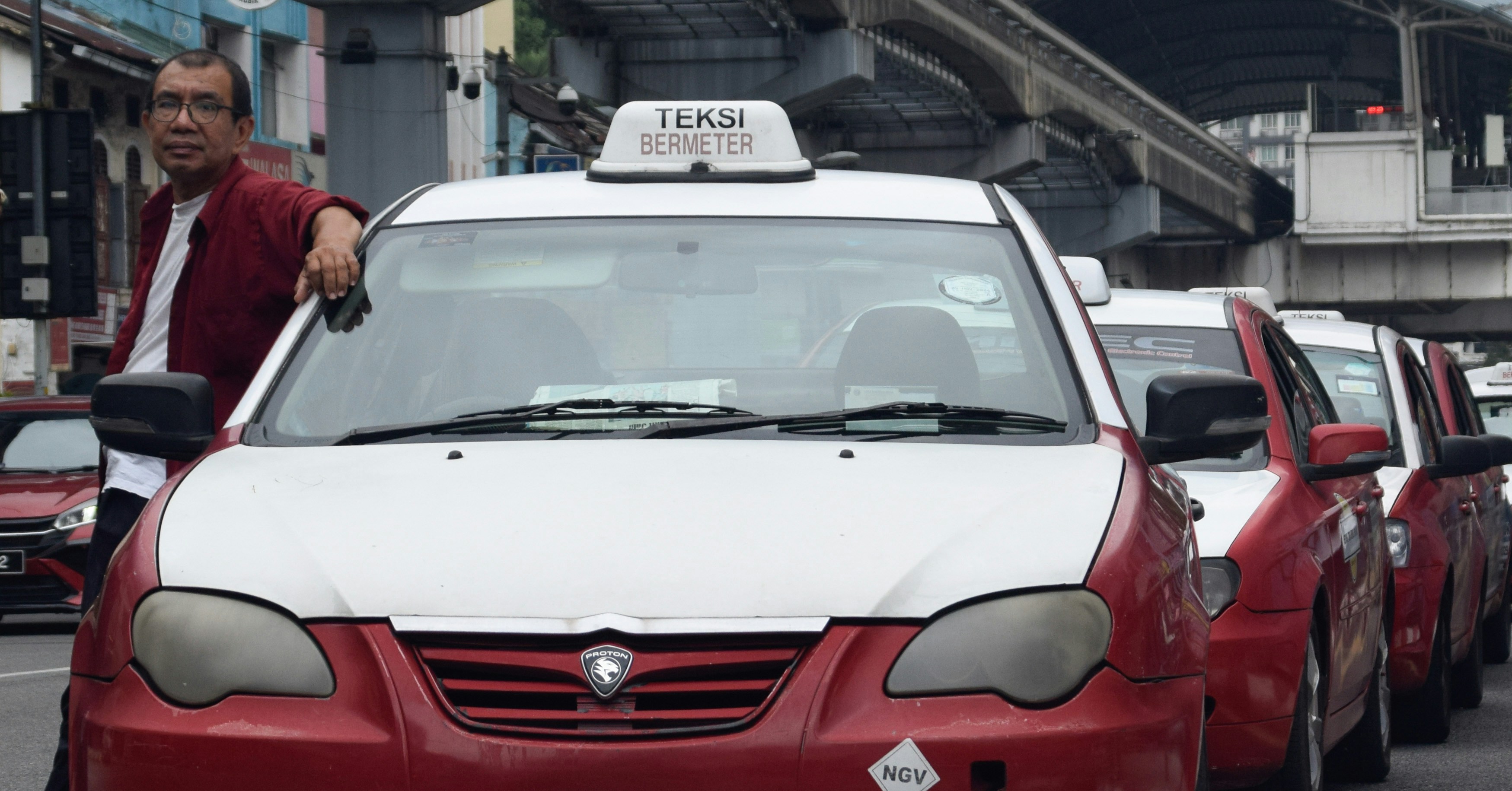 Crimson Cab Queue Beneath the City Canopy