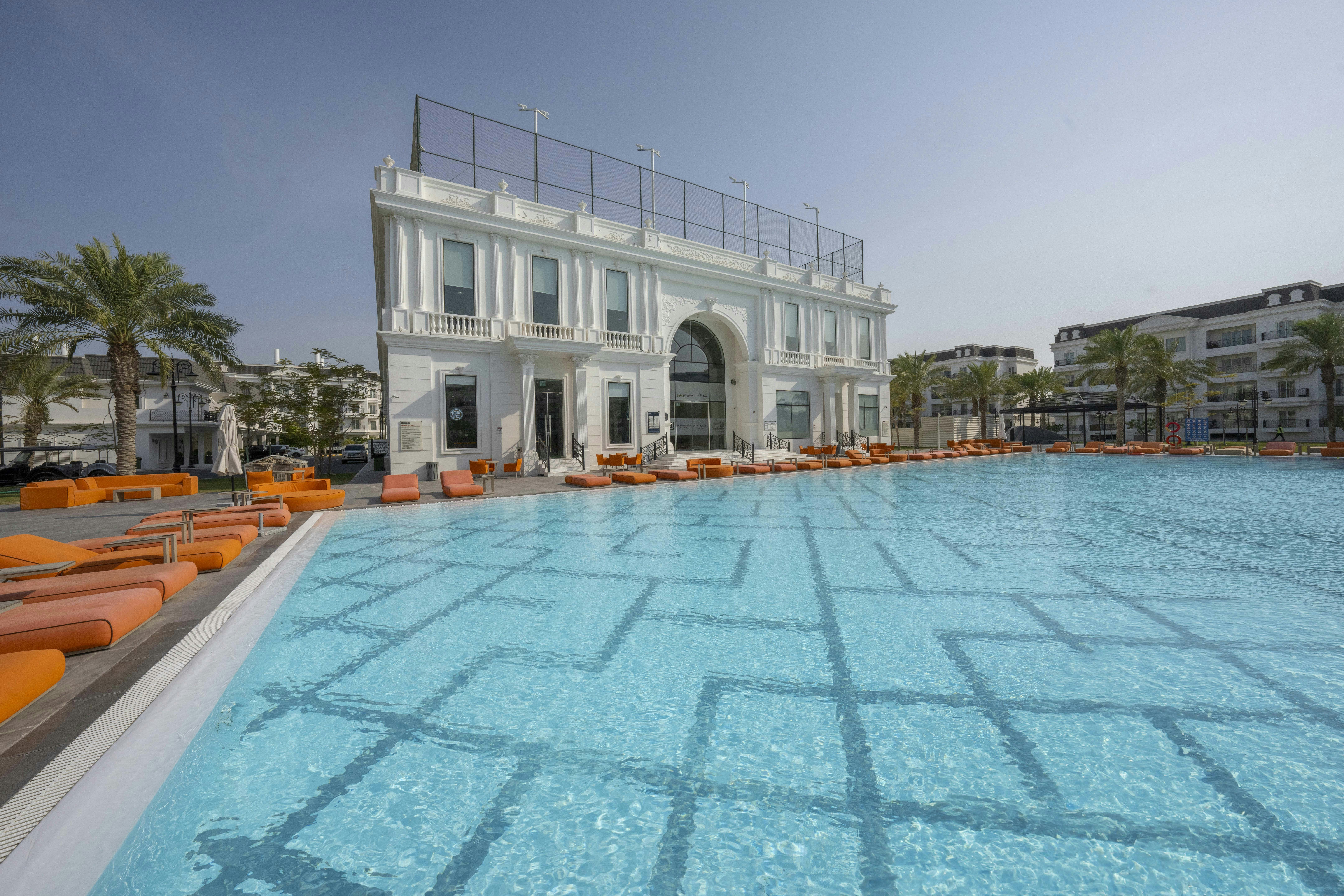 Azure Arch at the Pool: A Sunlit Resort Portrait