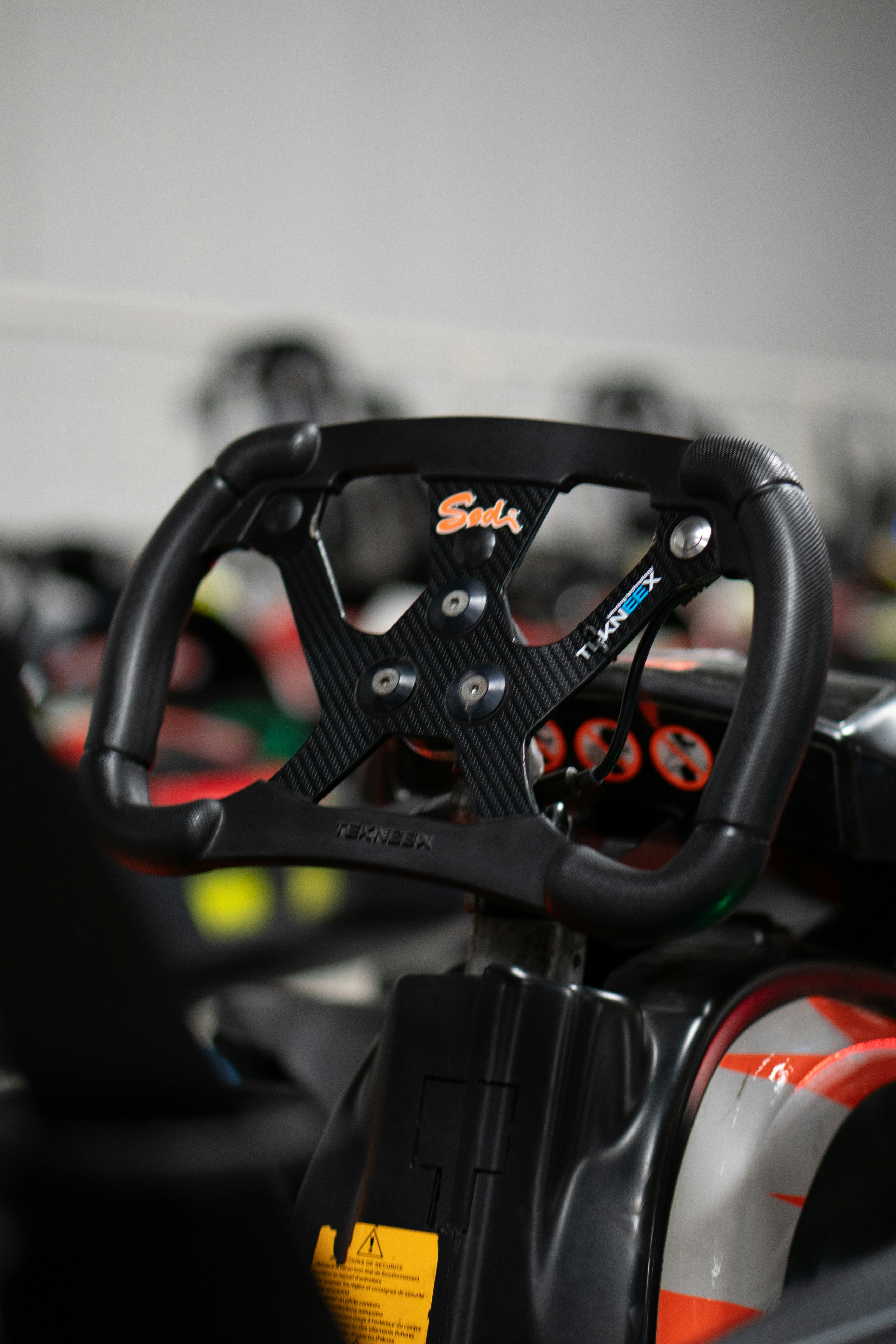 Precision in the Pit: Carbon-Fiber Steering Wheel Dominates the Frame