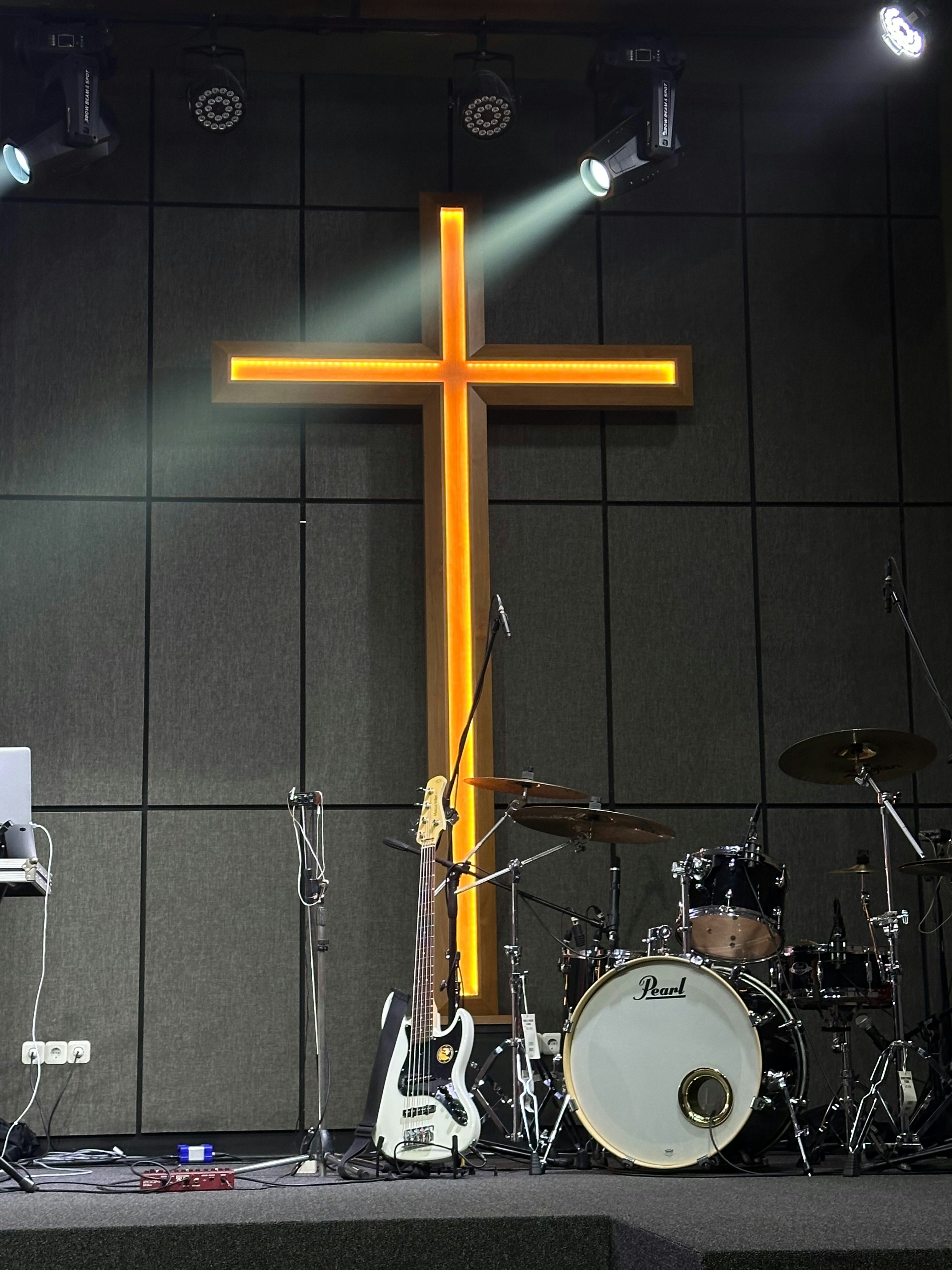 A cross on a stage with musical instruments photo – Free Cross Image on ...