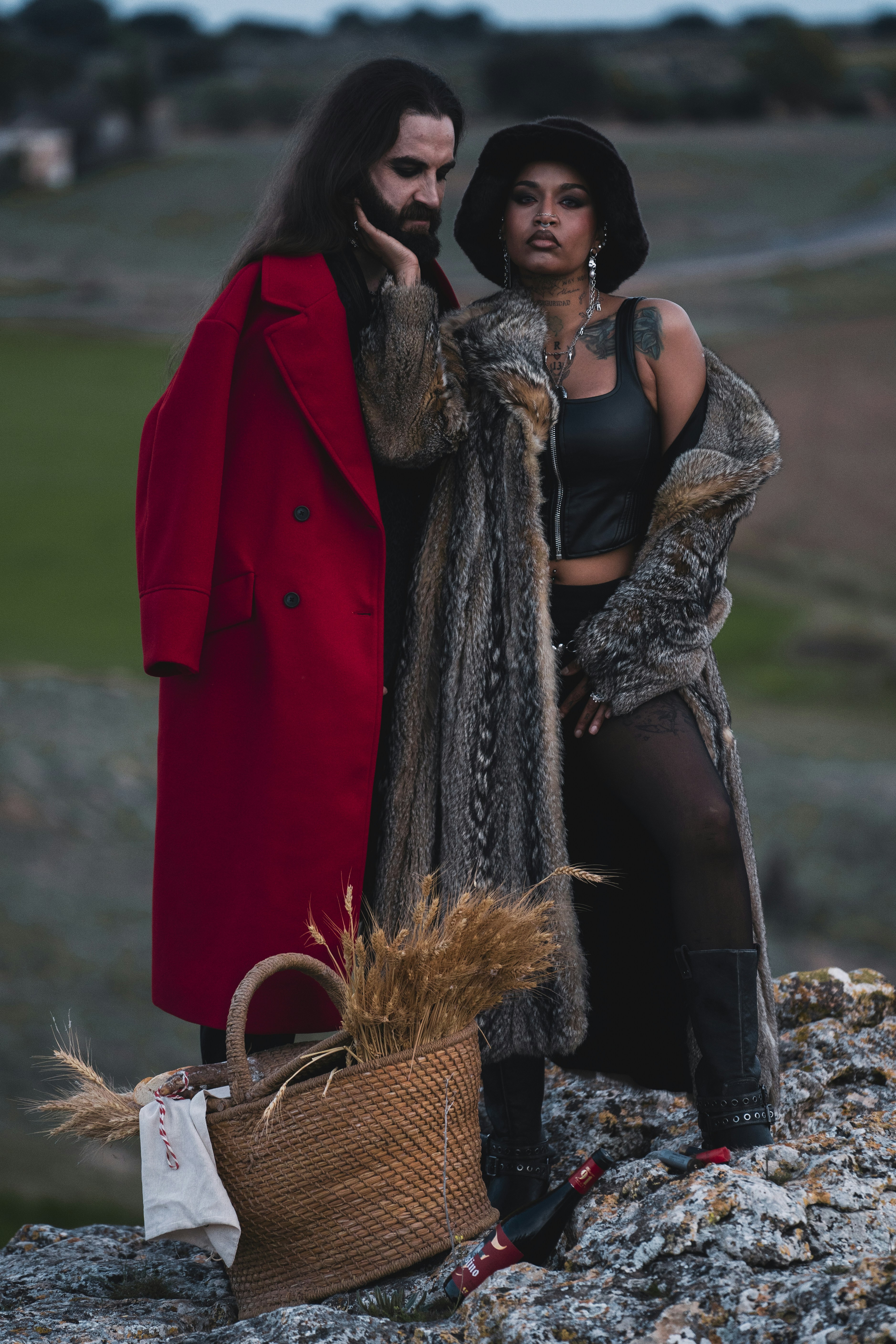 Two Fashioned Figures on a Cliff: Velvet, Fur, and Sunset Silence