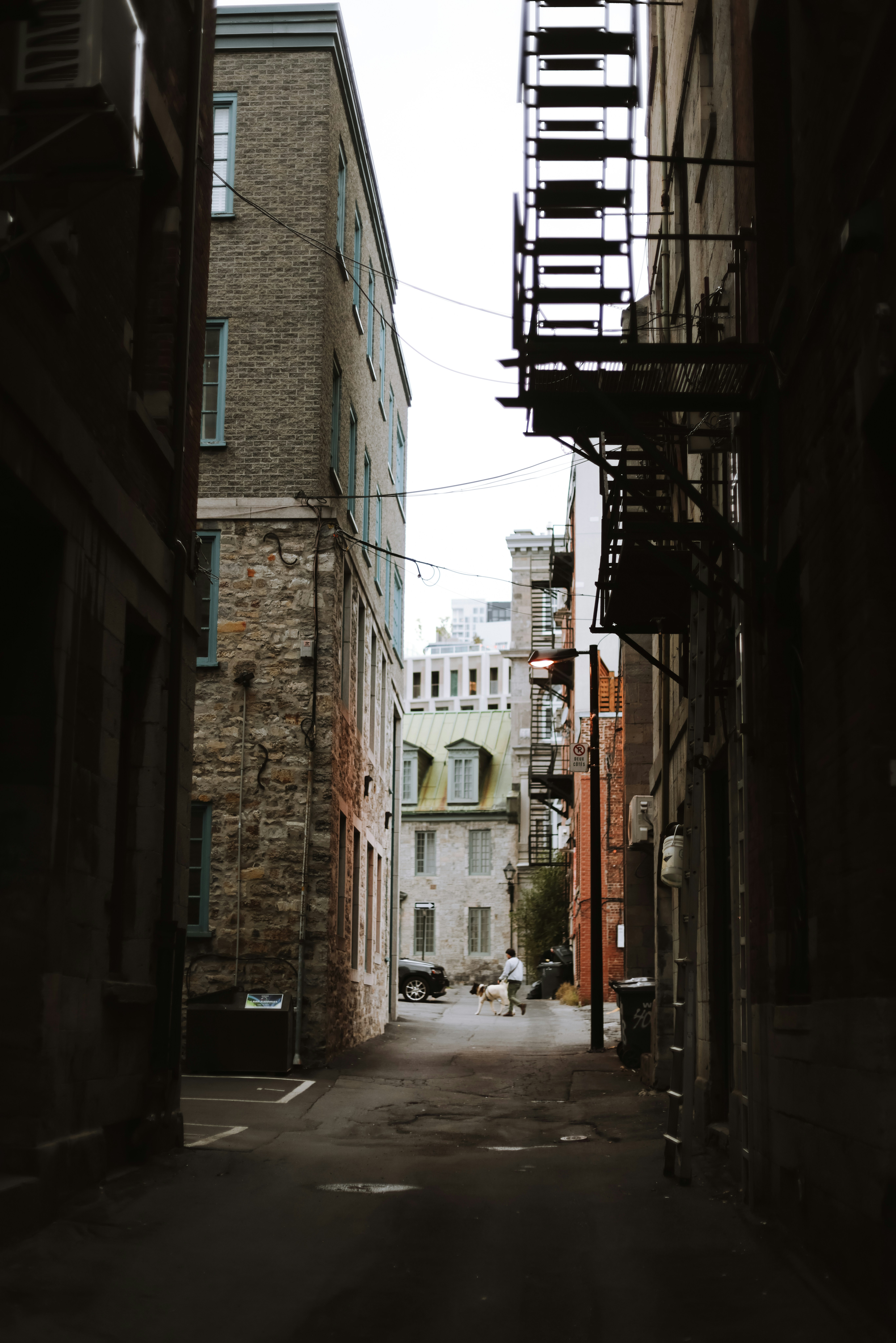 A narrow alley way with a fire escape photo – Free Montreal Image on ...