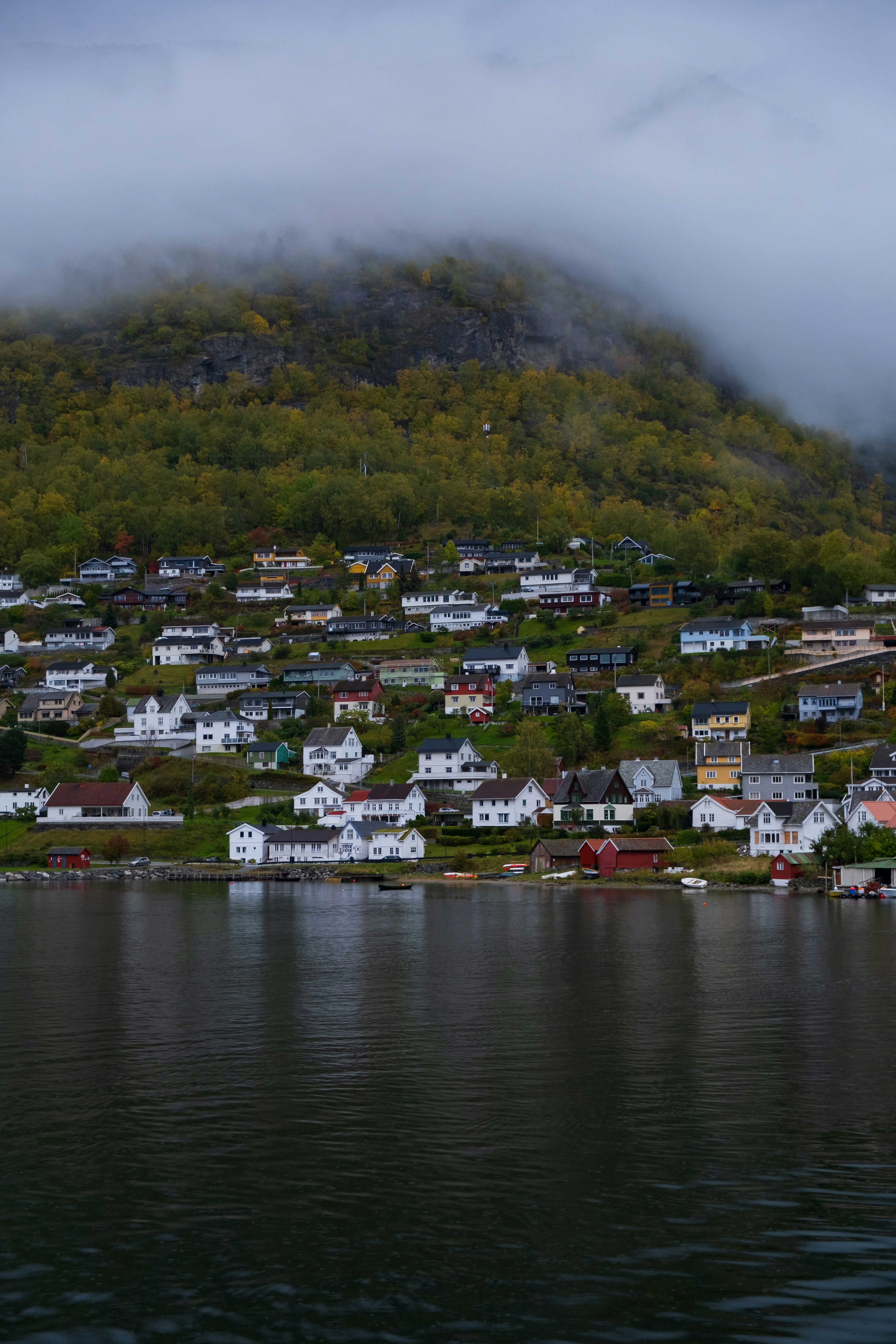 Mist-Softened Village by a Quiet Fjord